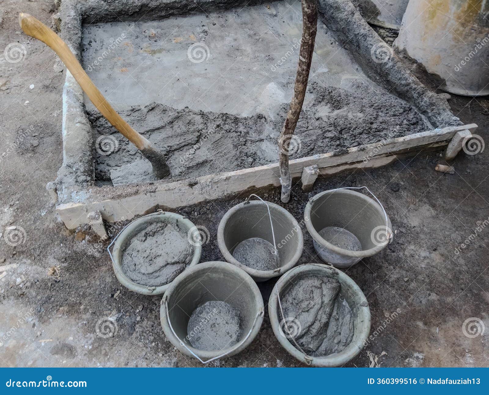 Construction Site with Concrete Mixing Buckets and Tools in Outdoor ...