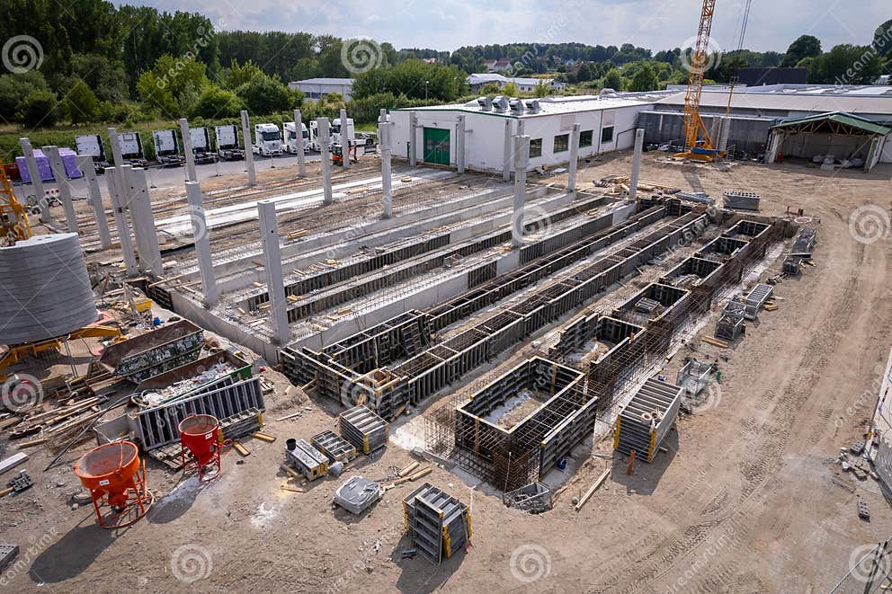 On a Construction Site Concrete Pillars are Erected for the ...