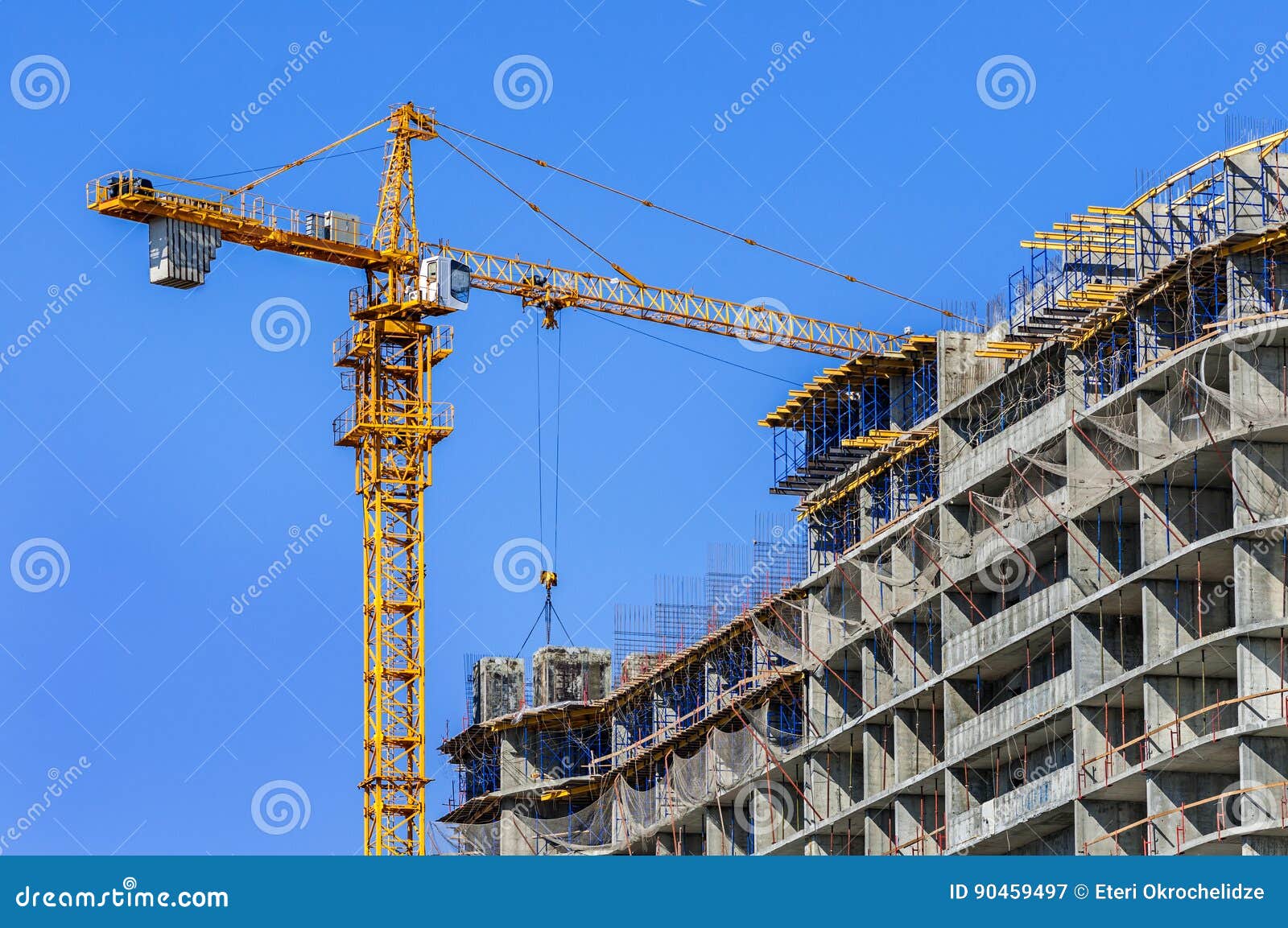 Construction Site. Construction Crane and High-rise Building Under ...
