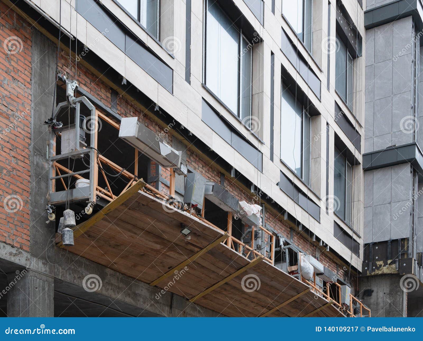 Construction Site Cradle on a Skyscraper for Renewval Repair Stock ...