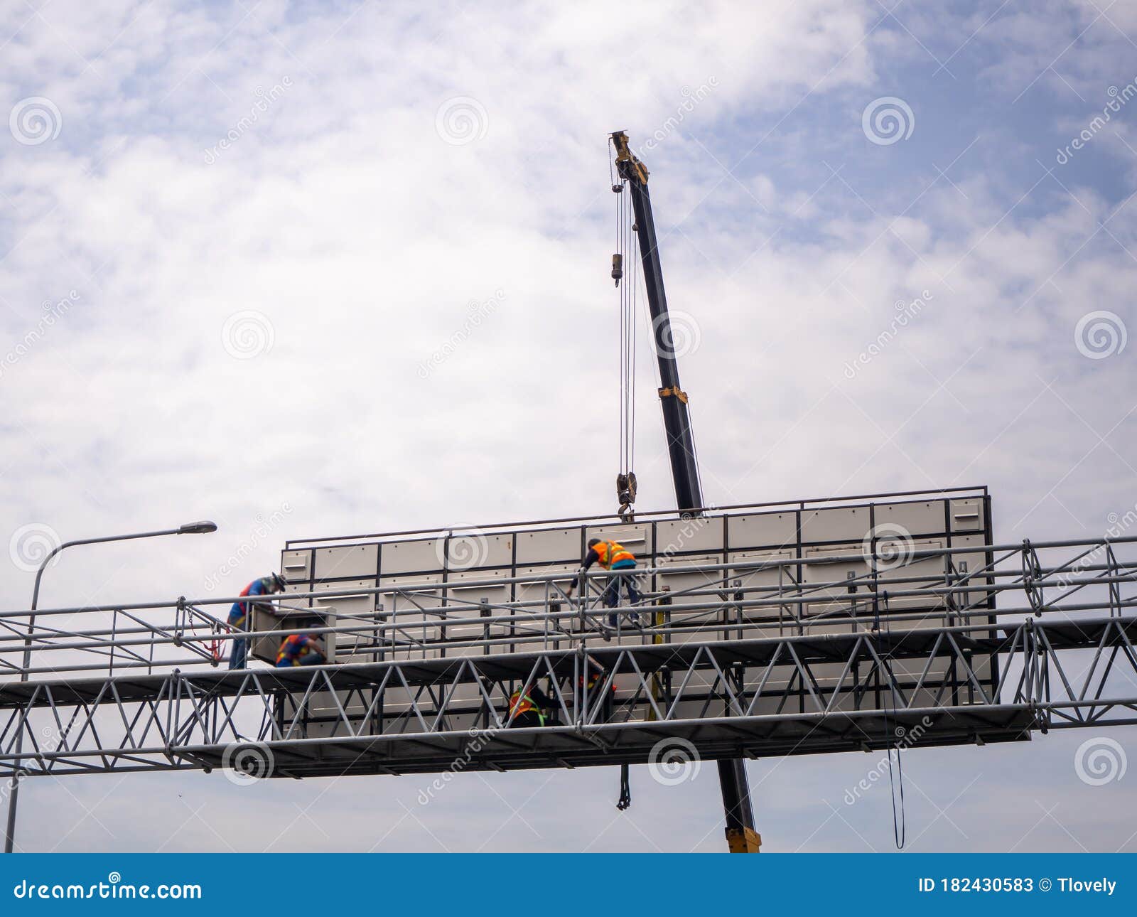 Construction Site Crane is Lifting a Led Signboard for Advertisement ...