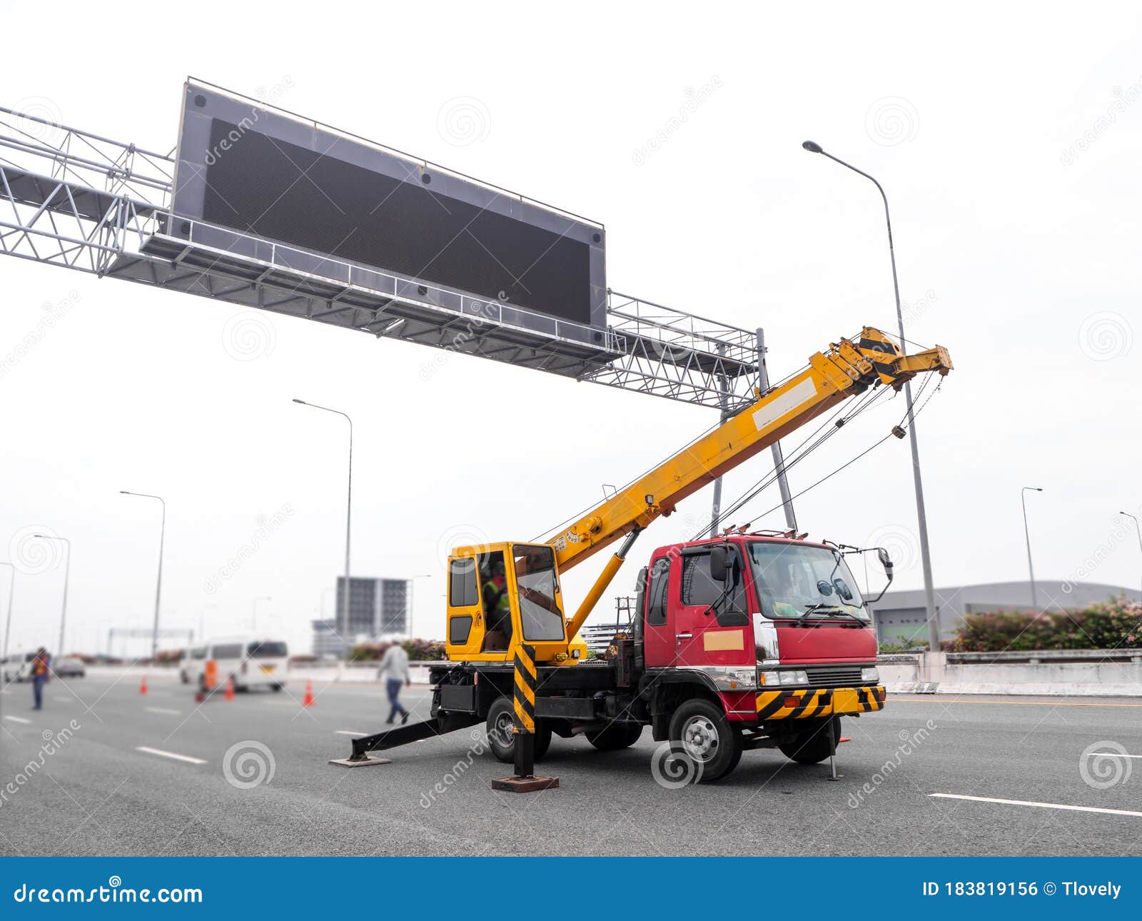 Construction Site Crane is Lifting a Led Signboard for Advertisement ...