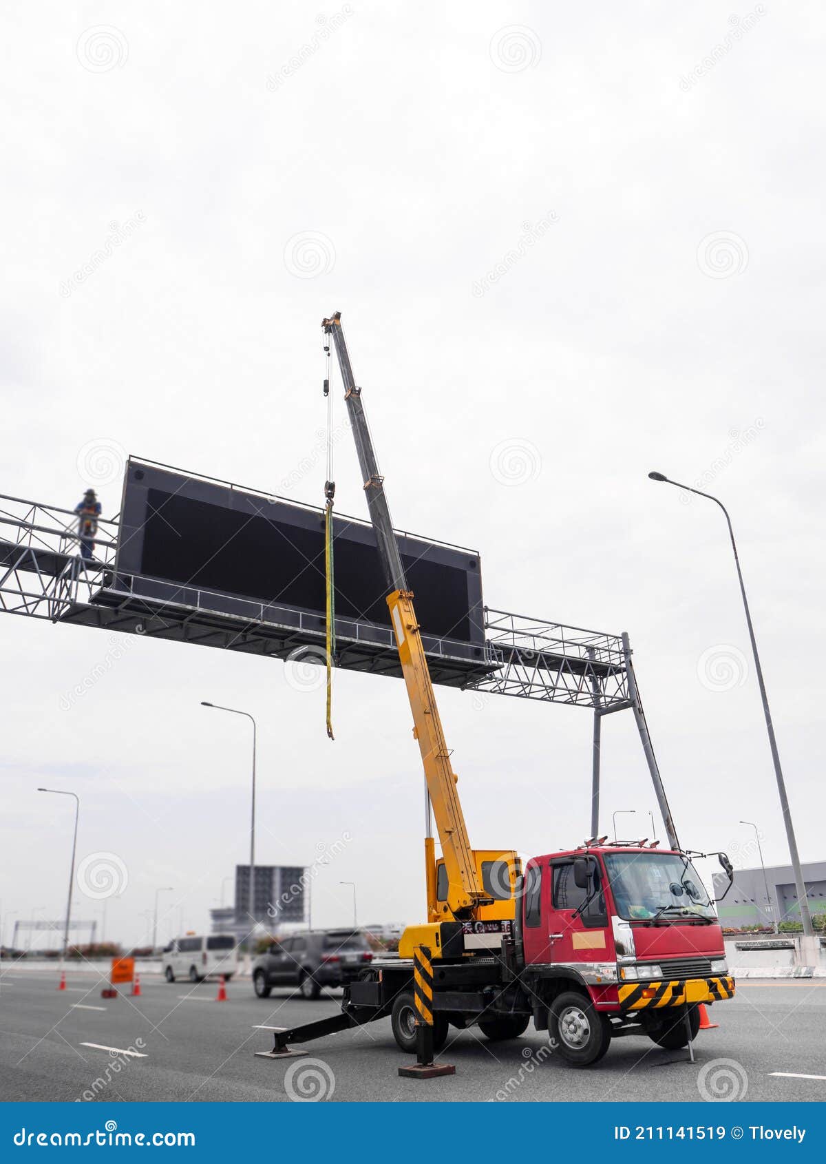 Construction Site Crane is Lifting a Led Signboard for Advertisement ...