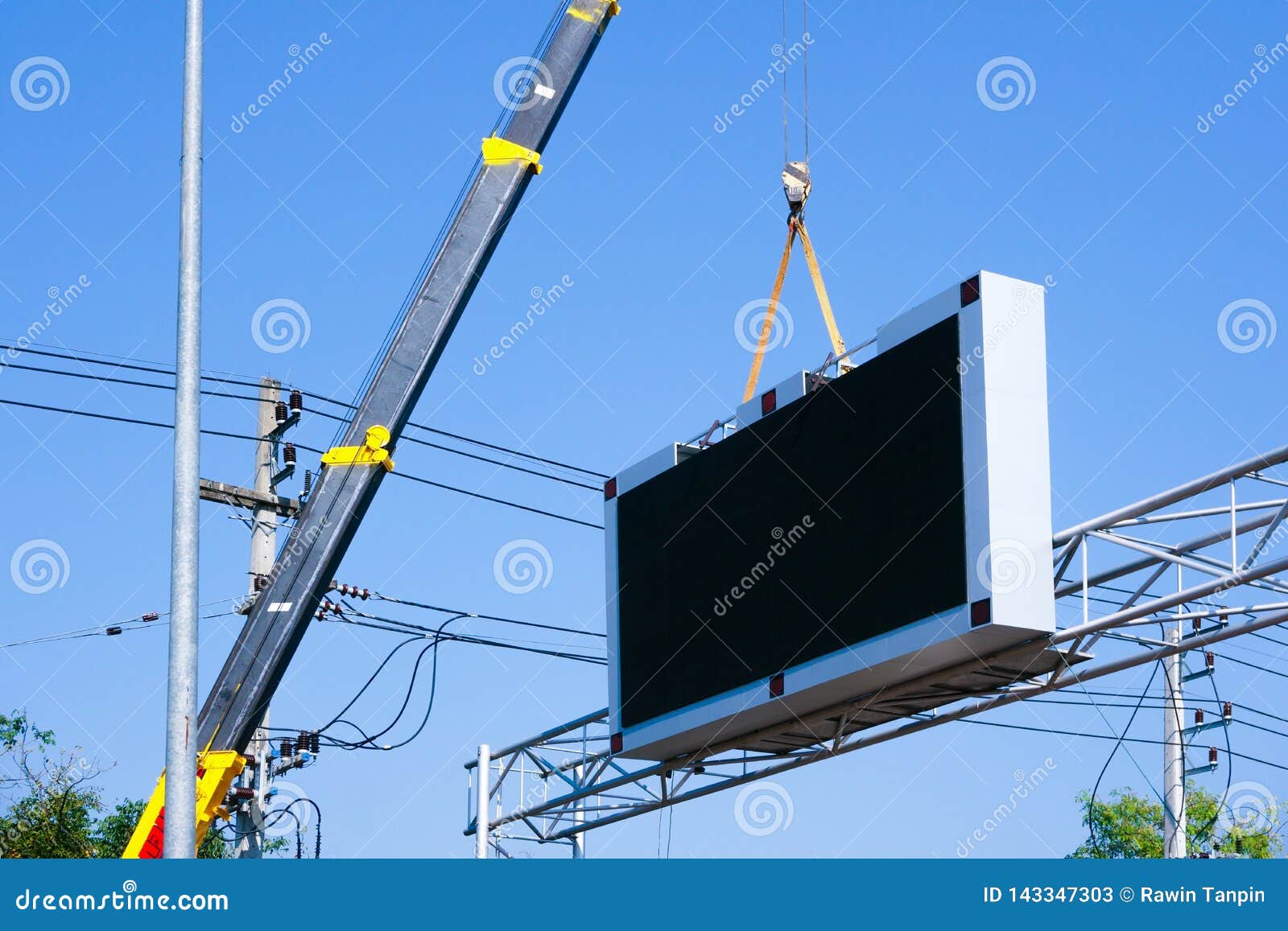 Construction Site Crane is Lifting a Led Signboard Blank Billboard on ...