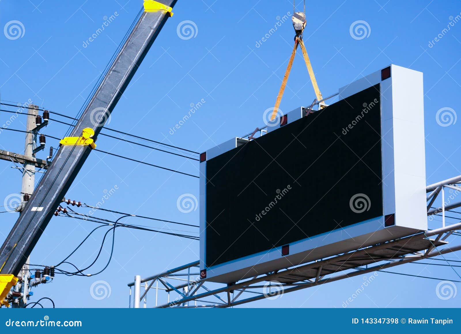 Construction Site Crane is Lifting a Led Signboard Blank Billboard on ...