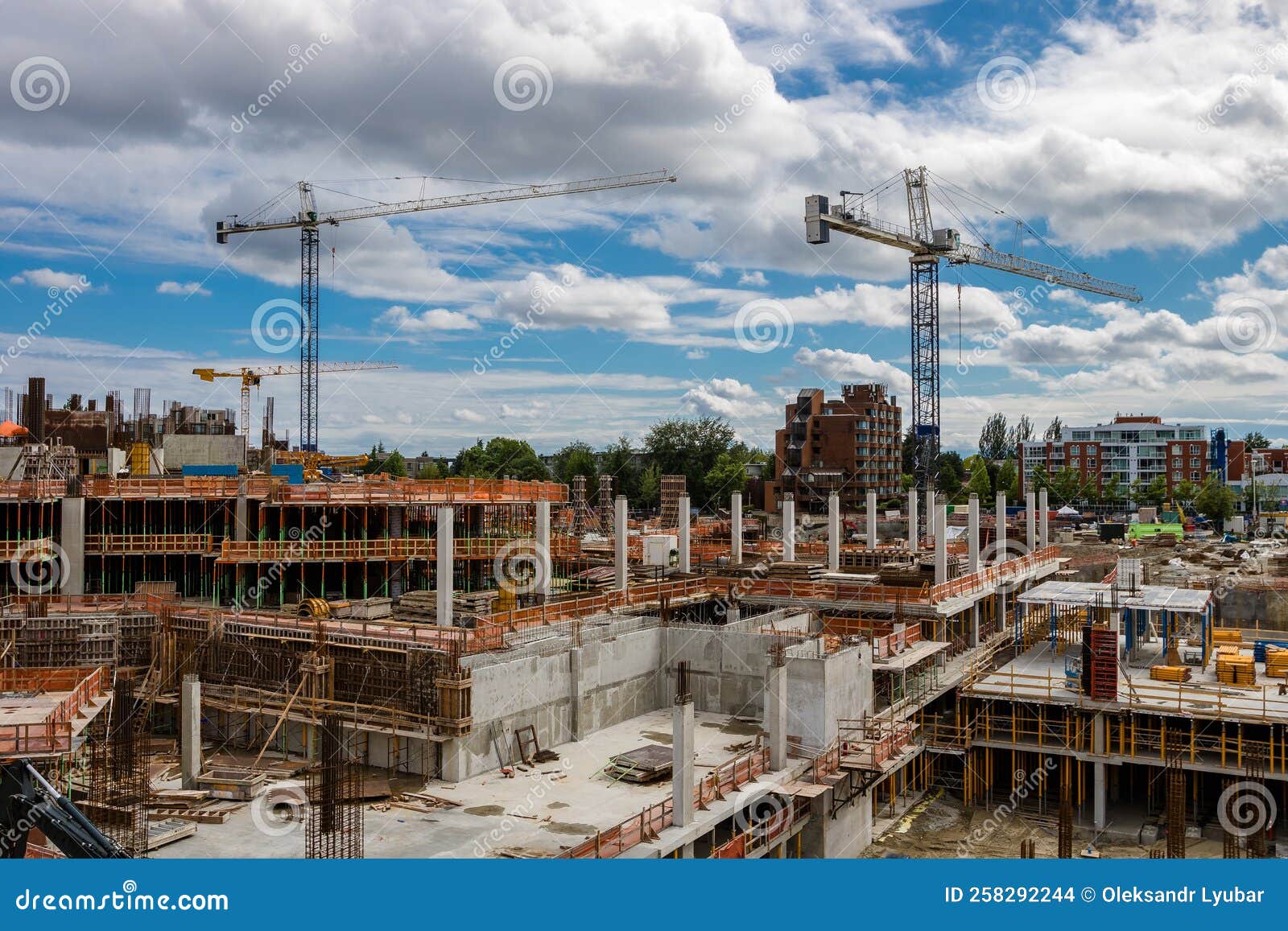 Construction Site with Cranes on the Background of Cloudy Sky Stock ...