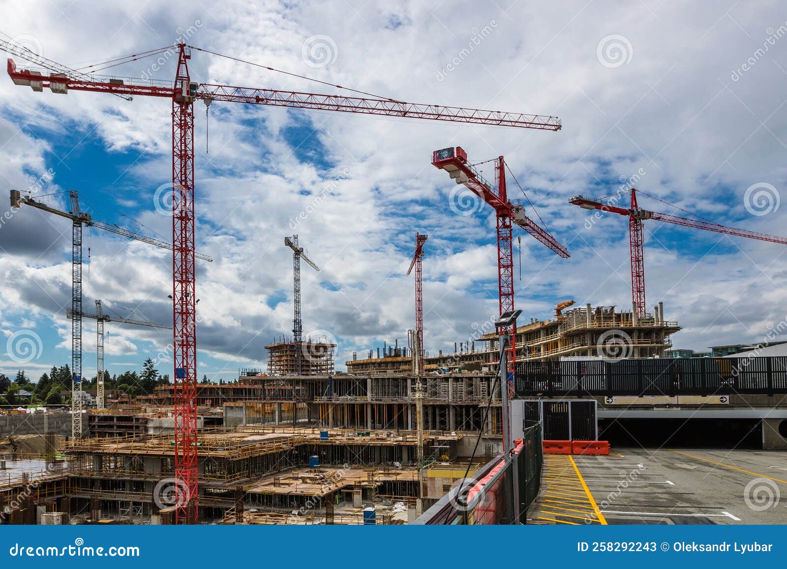 Construction Site with Cranes on the Background of Cloudy Sky Editorial ...