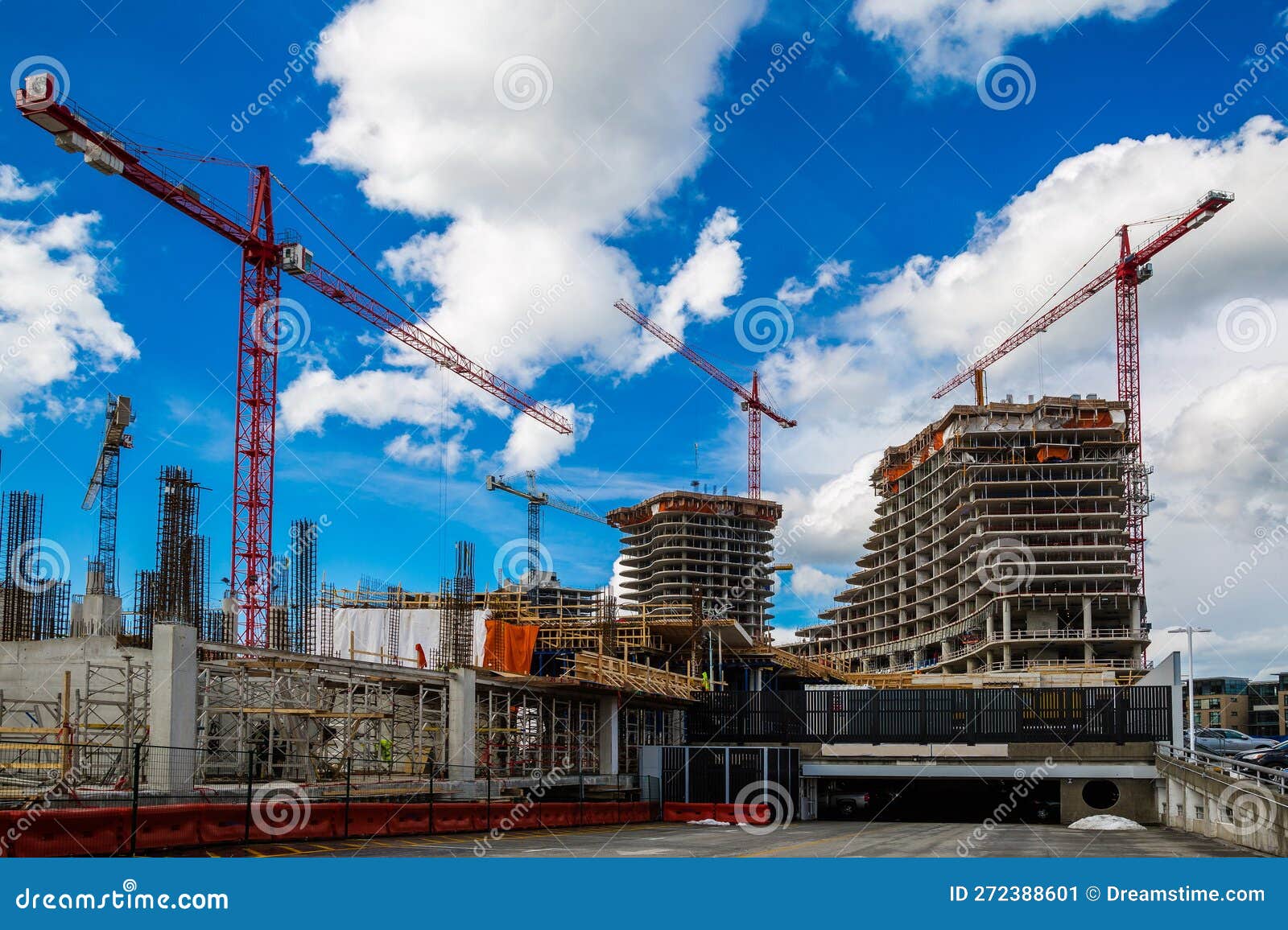 Construction Site with Cranes on the Background of Gray Sky Stock Image ...
