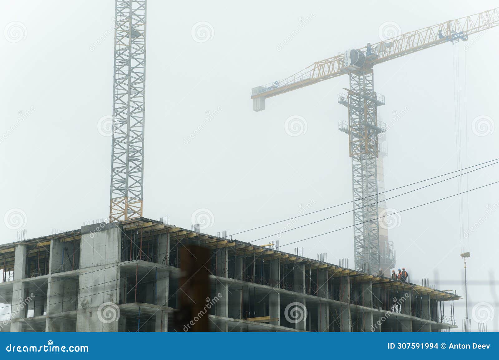 Construction Site with Cranes in the Fog Editorial Stock Image - Image ...