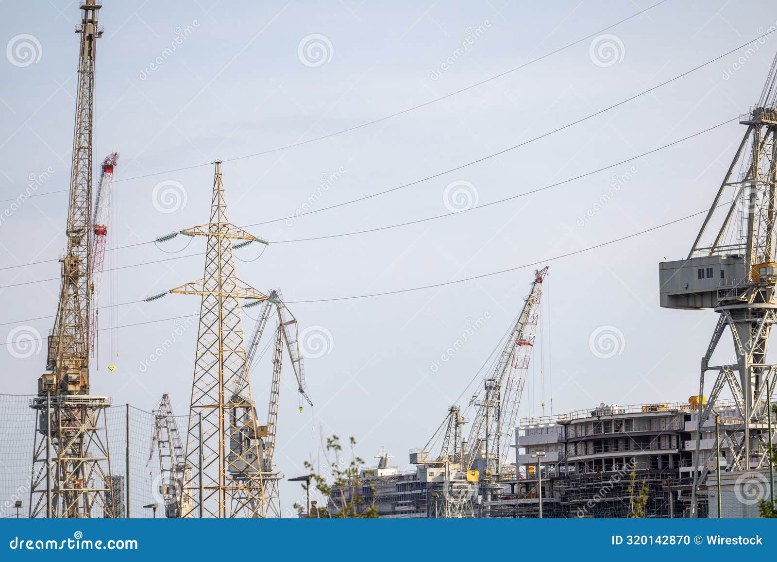 Construction Site with Cranes and Power Lines Stock Photo - Image of ...