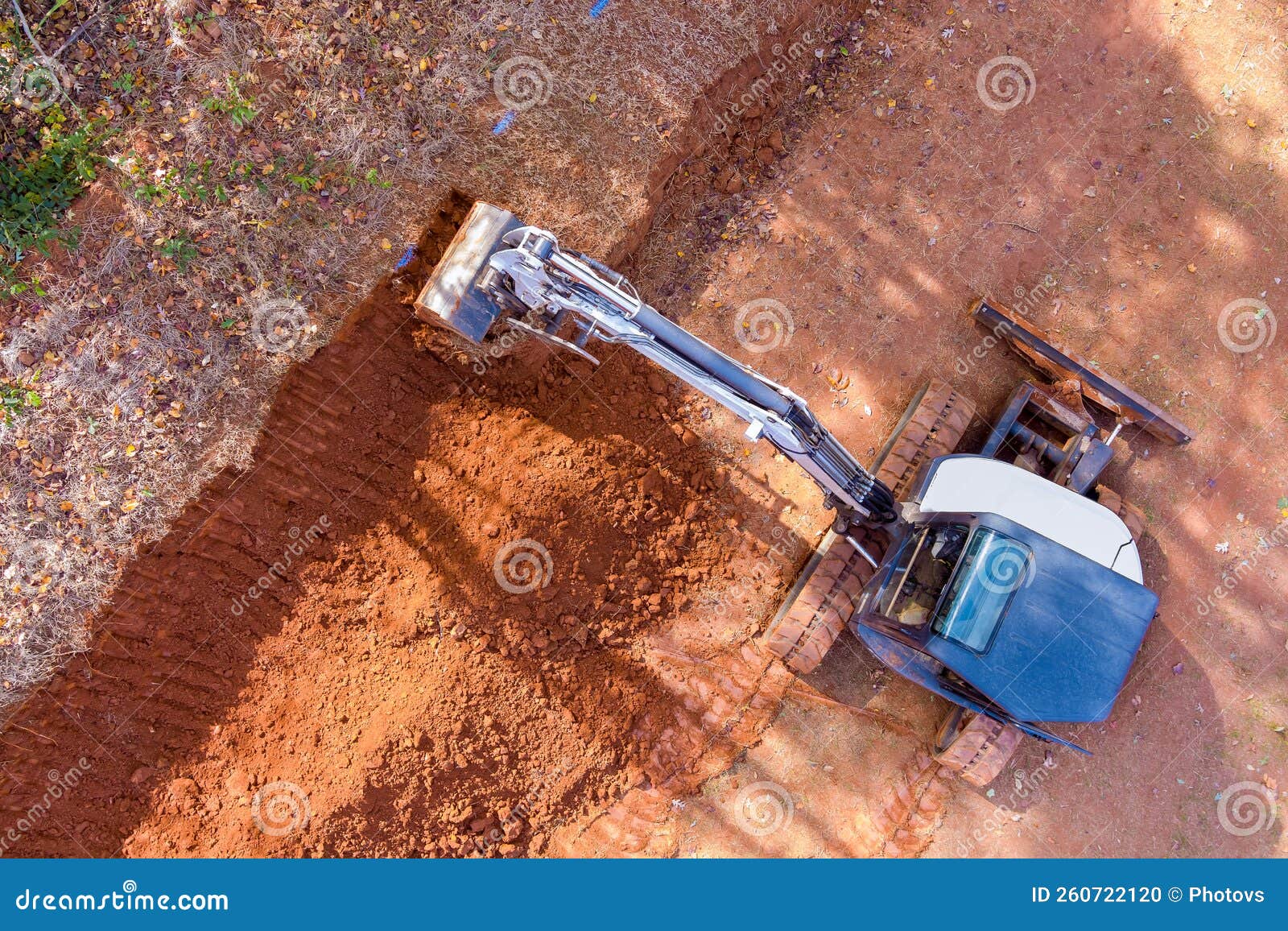 At a Construction Site, Crawler Excavators are Digging the Ground ...