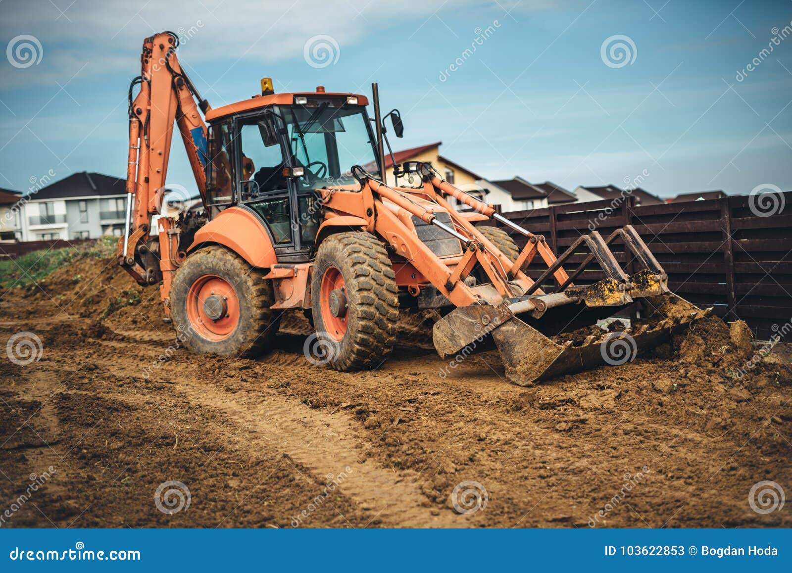 Construction Site Details with Backhoe Wheel Loader Moving Soil and ...