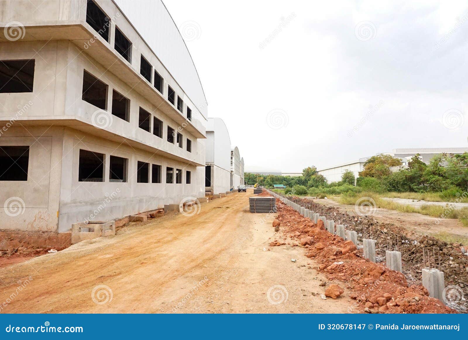 Construction Site : Driven Piles for Fence Around Office Warehouse ...