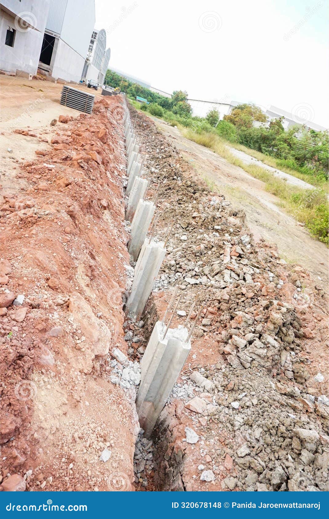 Construction Site : Driven Piles for Fence Around Office Warehouse ...