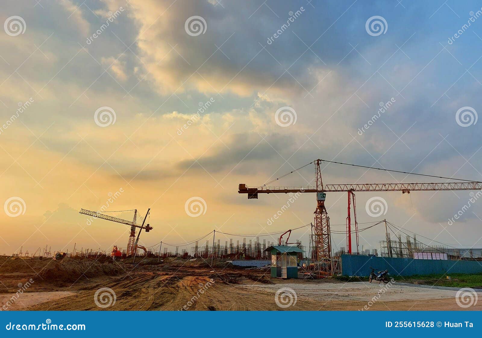 A Construction Site at Dusk with Two Tower Crane Stock Photo - Image of ...