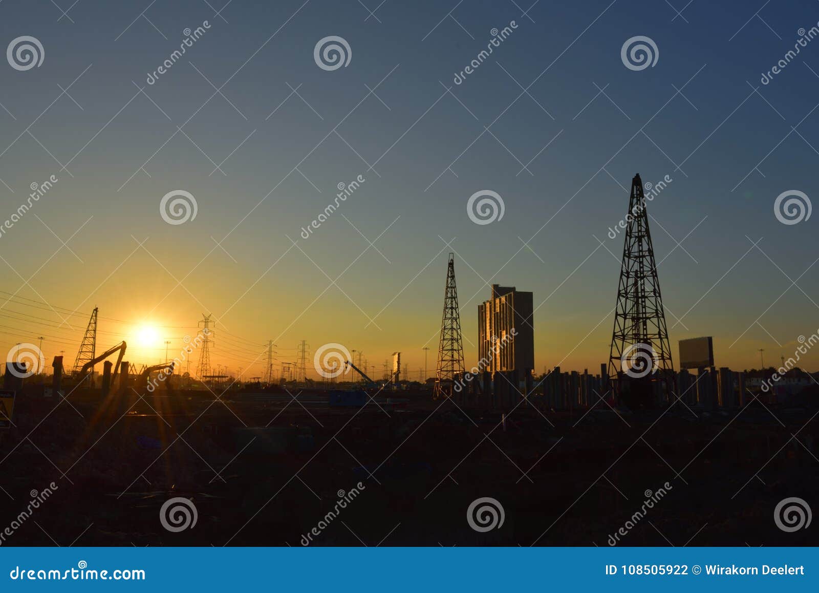 Construction Site and Electrical Pole with Sunrise Sky Stock Photo ...