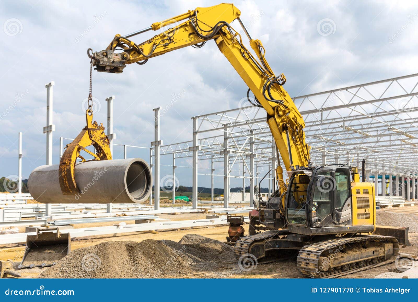 Construction Site Excavator with a Concrete Pipe Stock Photo - Image of ...