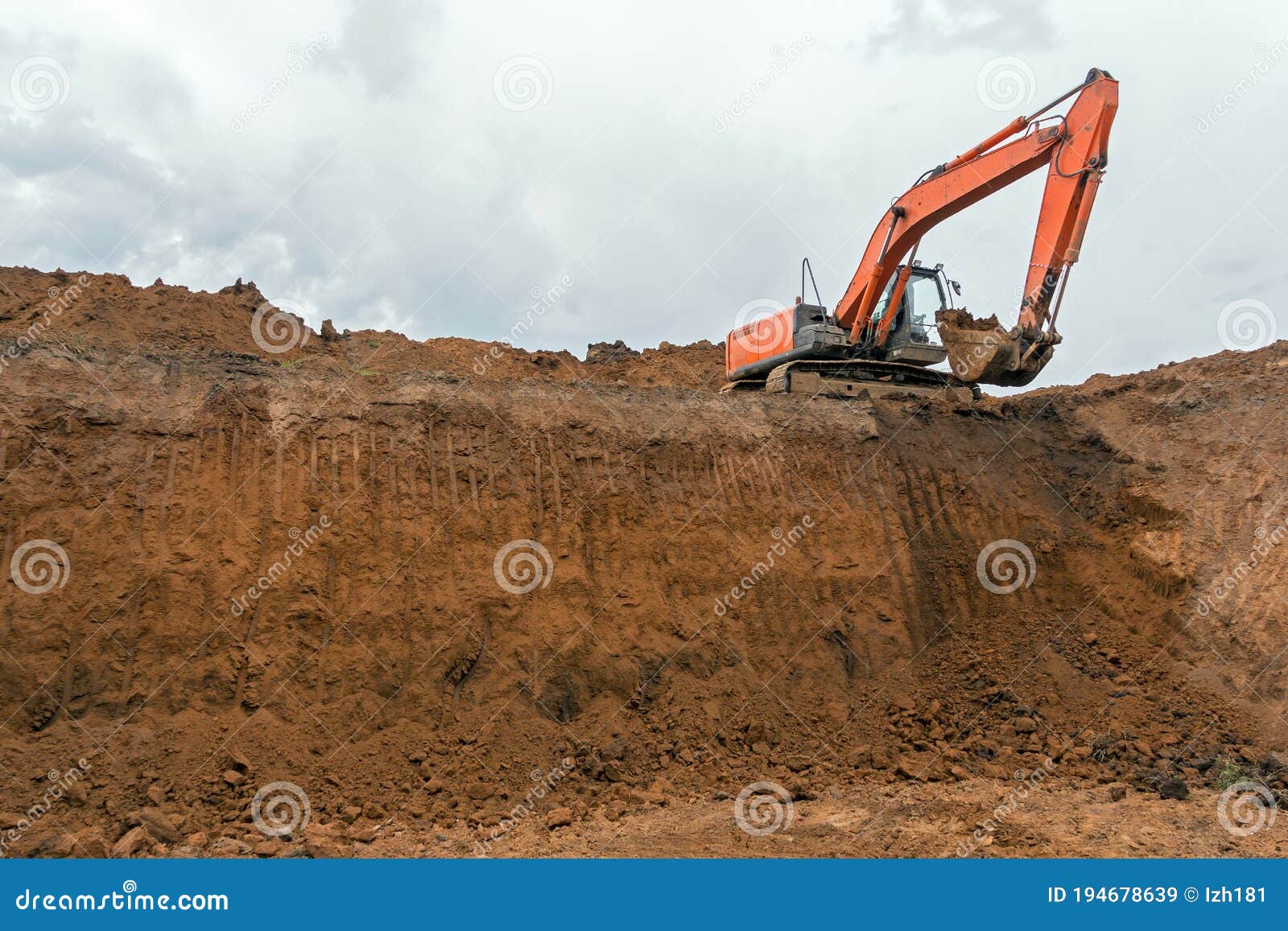 The Construction Site Excavator Digs a Deep Pit. Stock Image - Image of ...