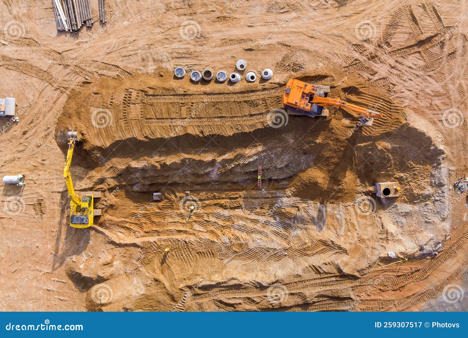 On the Construction Site, an Excavator Digs a Pit in Preparation for ...