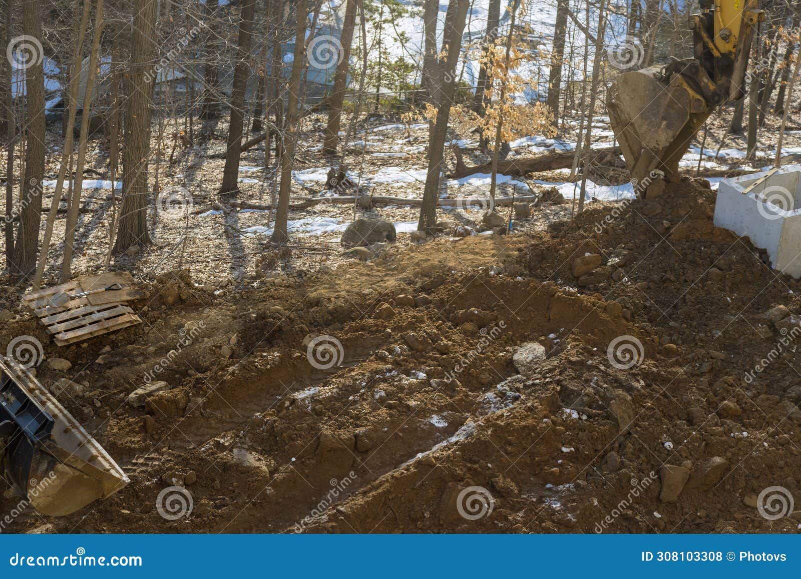 Excavator Dig The Trenches At A Construction Site. Trench For Laying ...