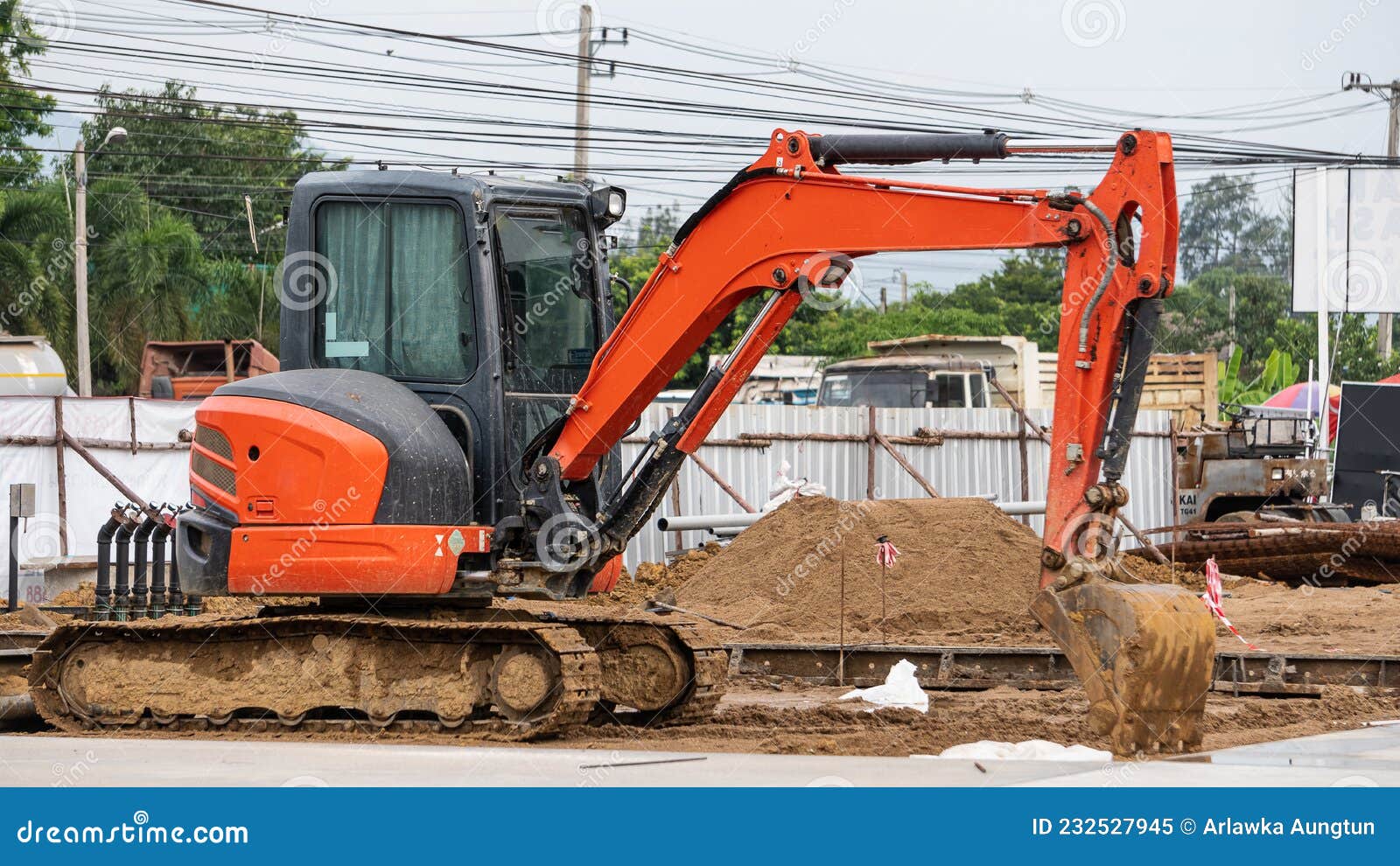 Construction Site Excavator Front View of Crawler Excavator Digs in the ...
