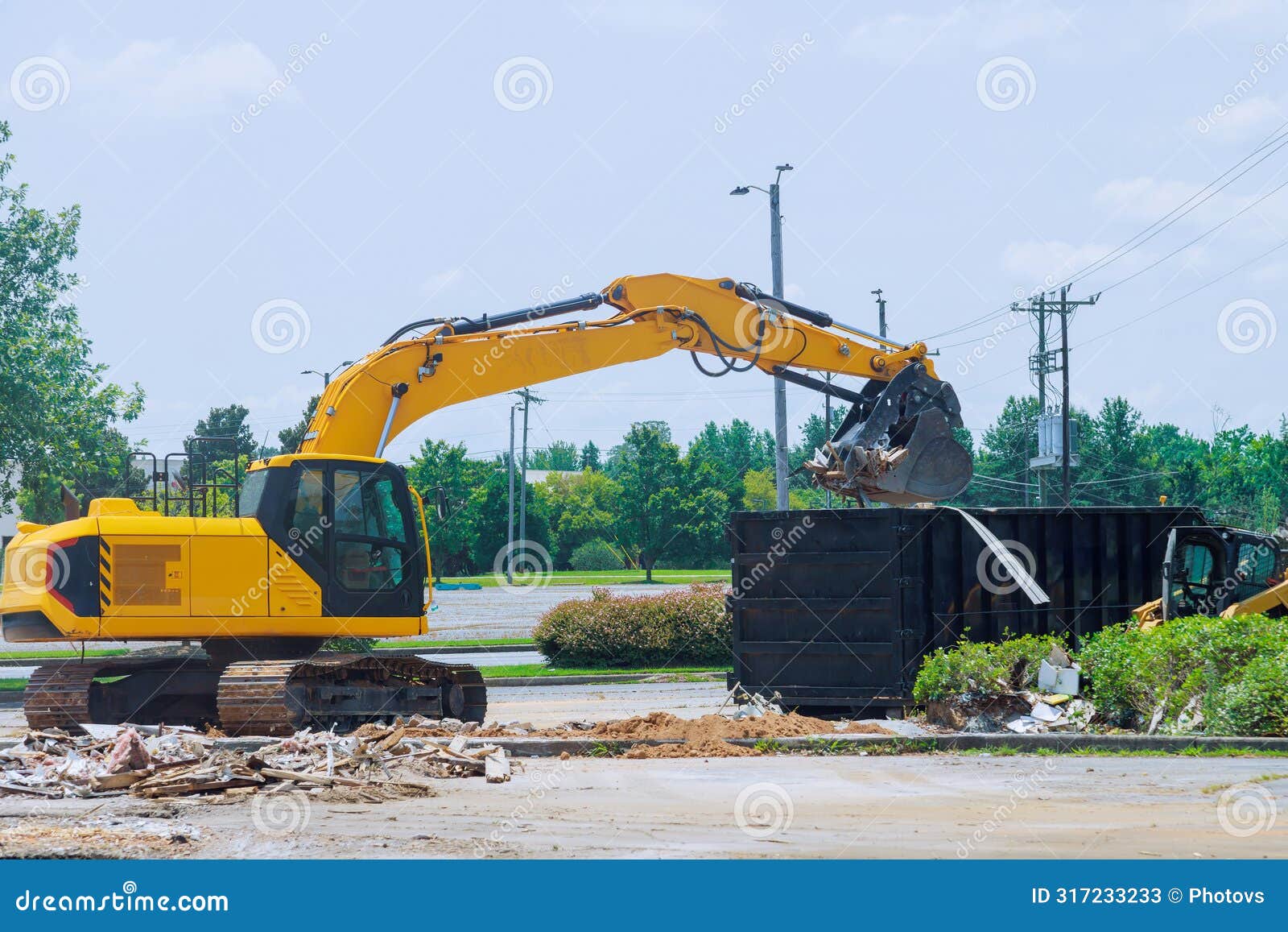 On Construction Site, an Excavator Loads Construction Concrete Waste ...