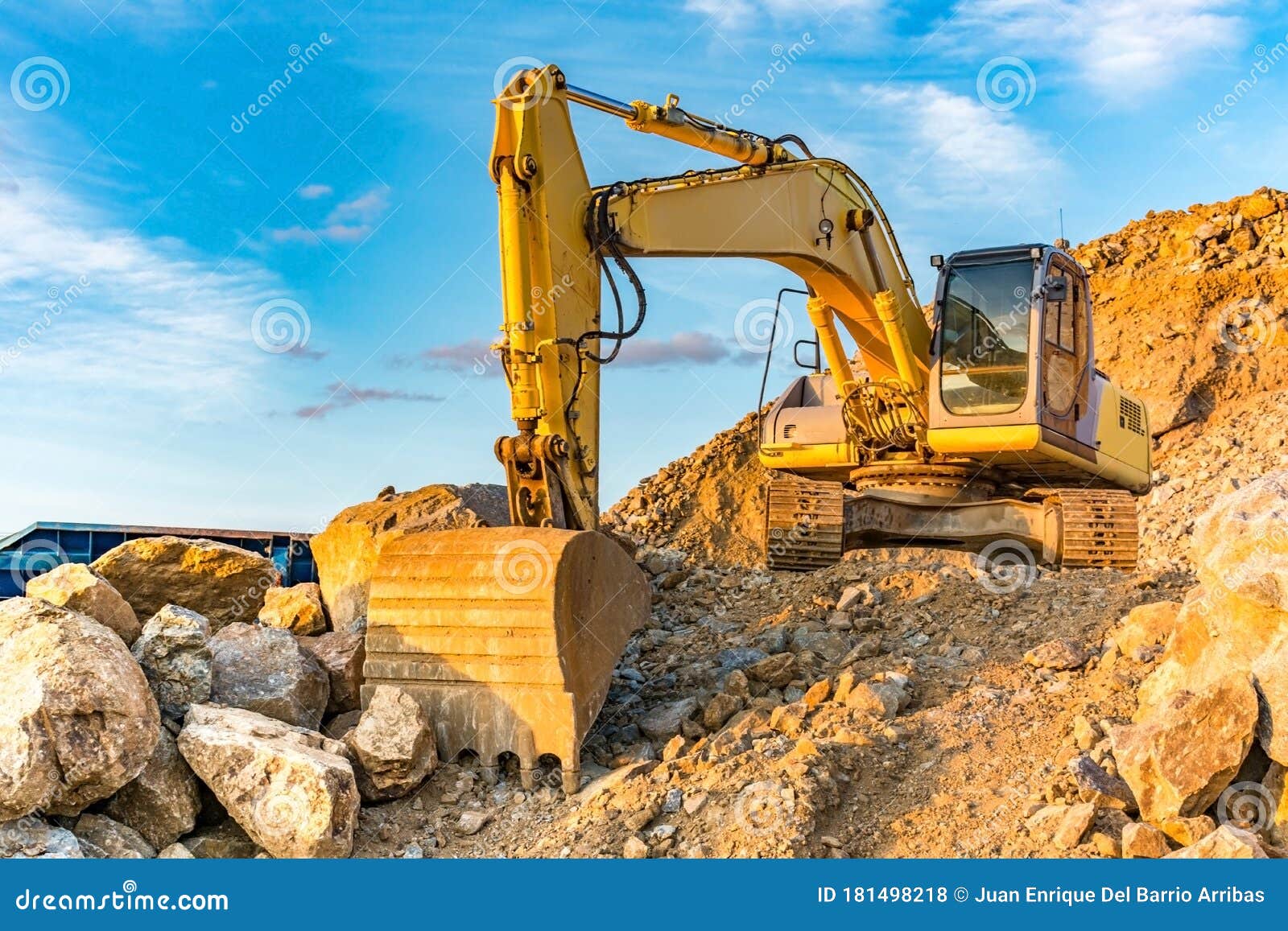Construction Site with an Excavator Moving Rock Stock Photo - Image of ...