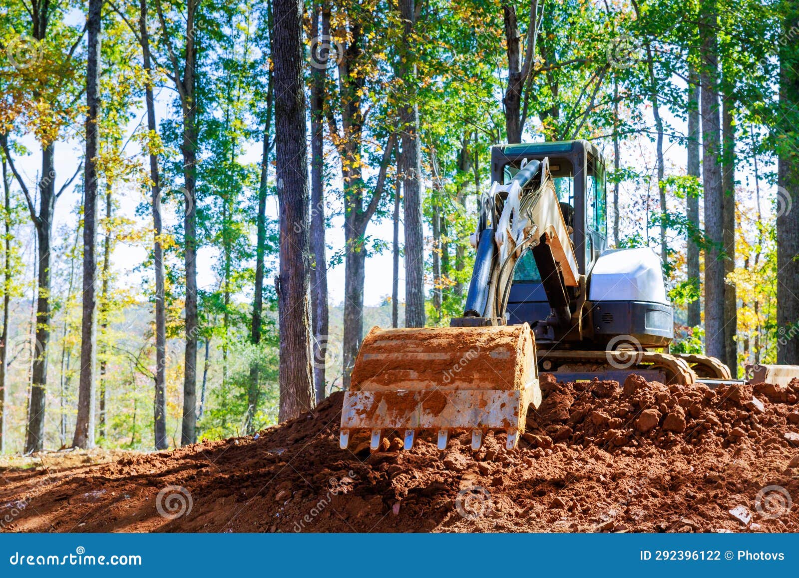 On Construction Site, an Excavator is Working To Prepare Ground for ...