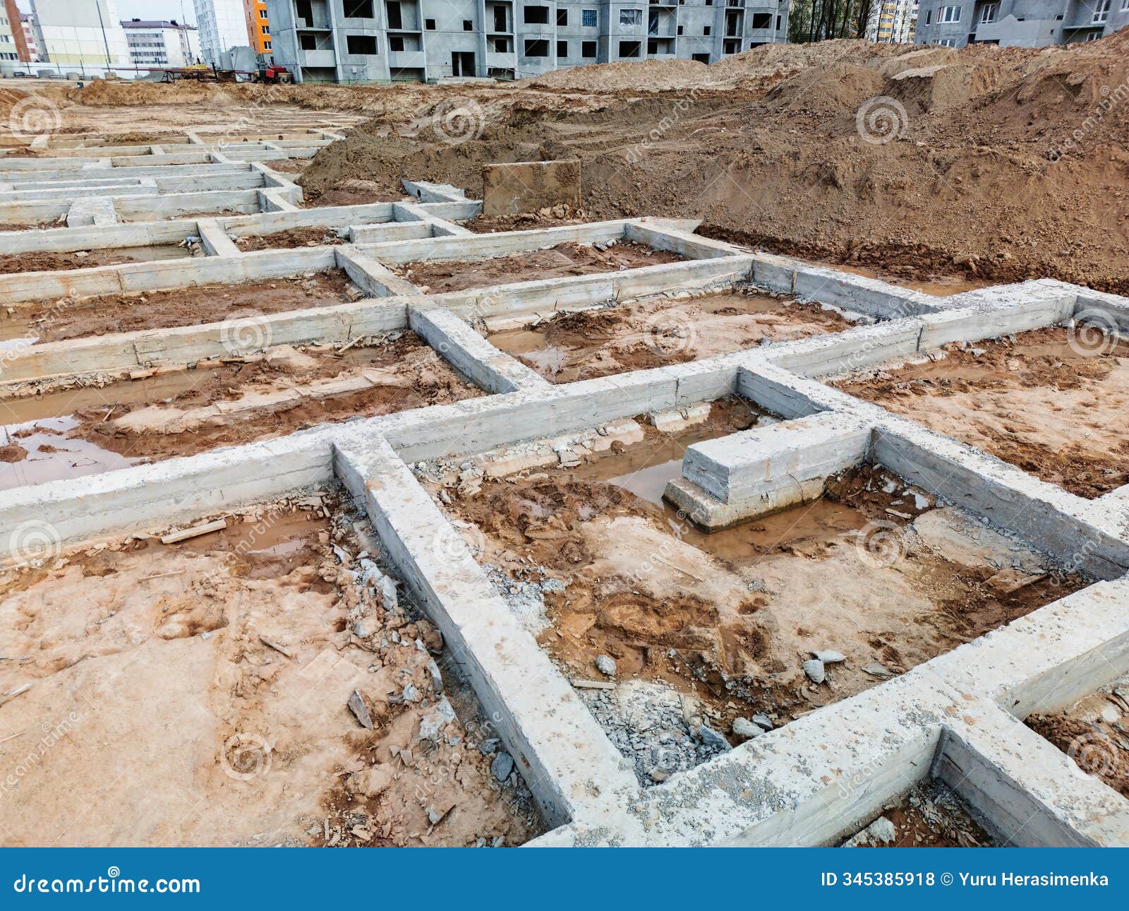 Concrete Foundations For The Columns Of A Factory Building Are Poured ...