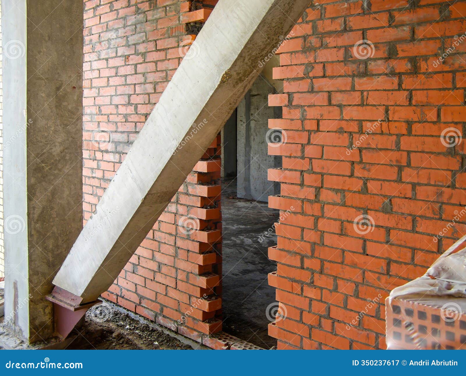 Construction Site Featuring a Brick Wall and Reinforced Concrete Column ...