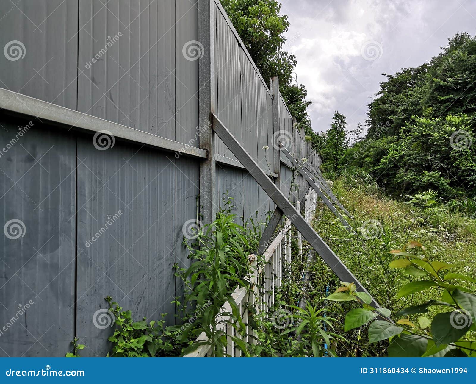Construction site fence stock photo. Image of construction - 311860434