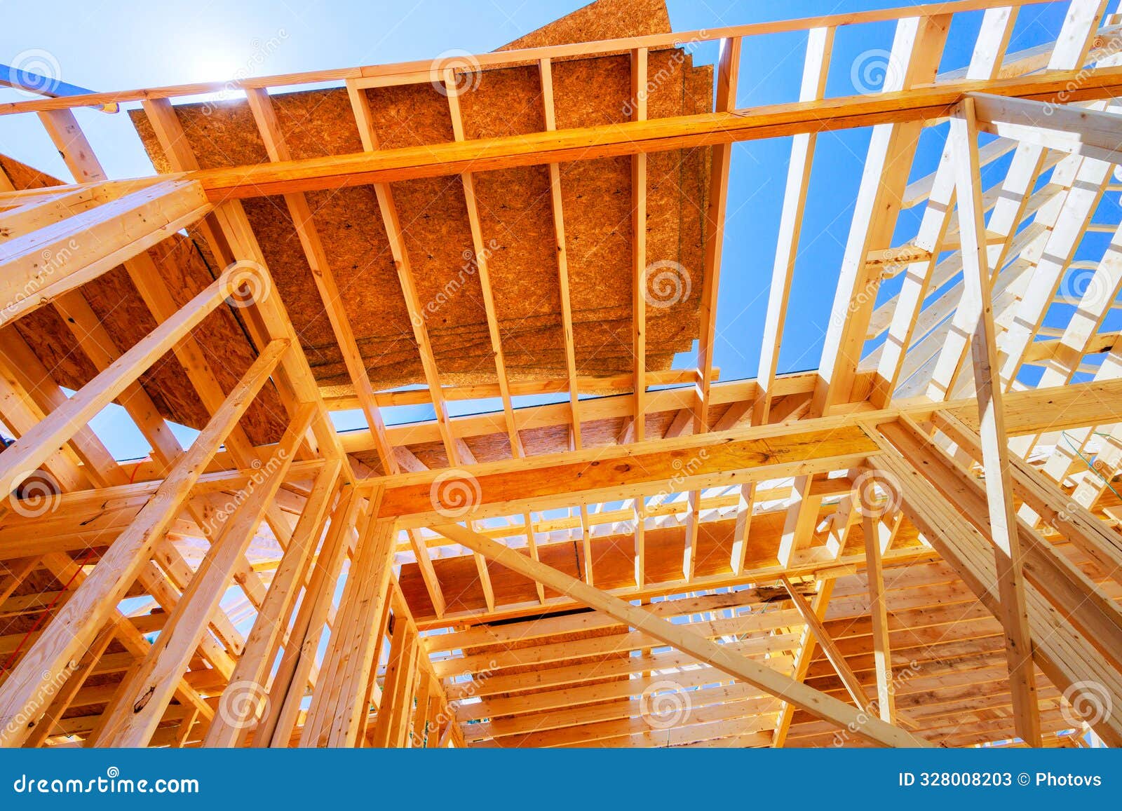 At Construction Site Framing with Wooden Beams, Posts, a Trusses for ...