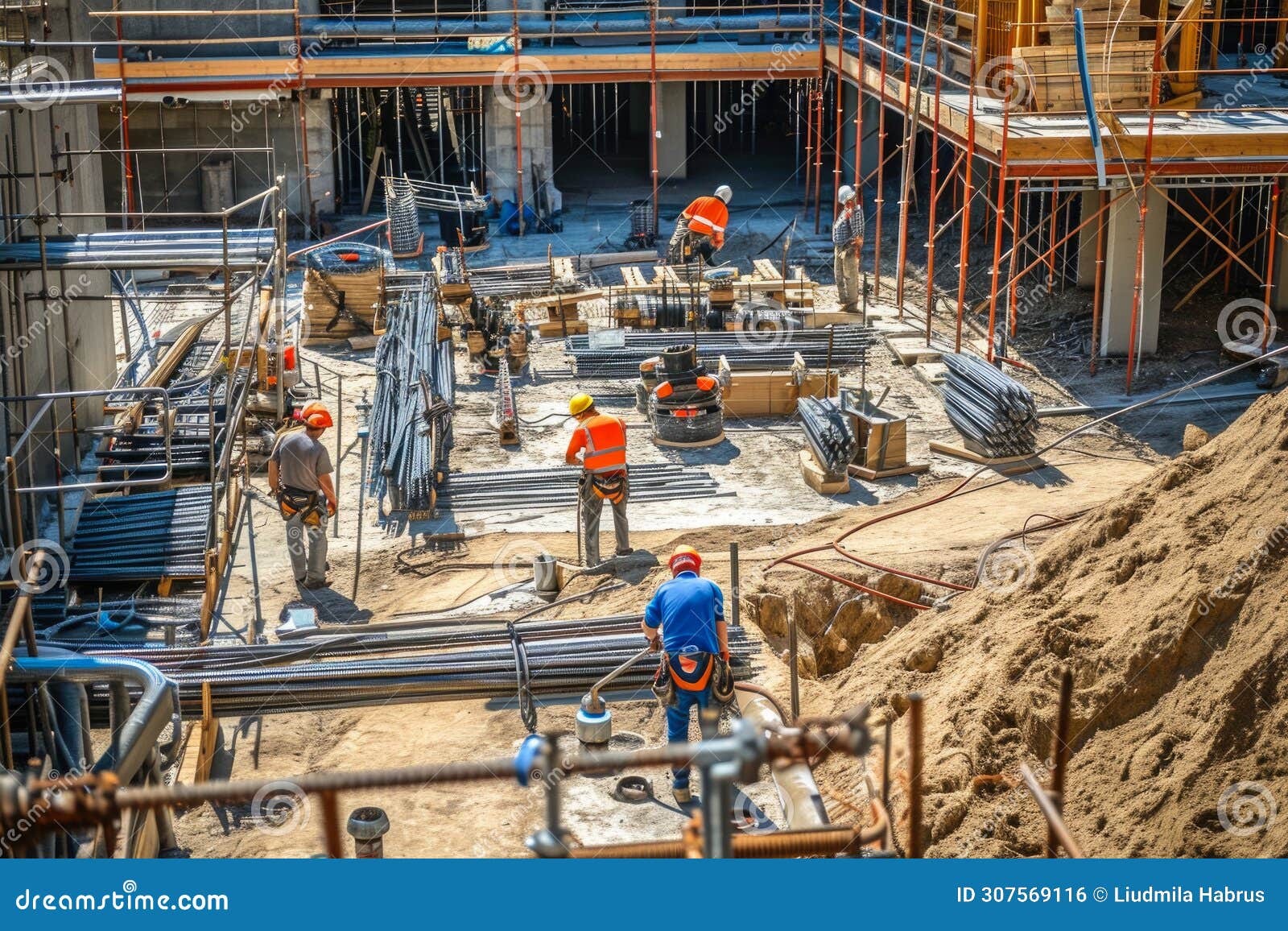 Construction Site with a Group of Workers Installing Electrical Wiring ...
