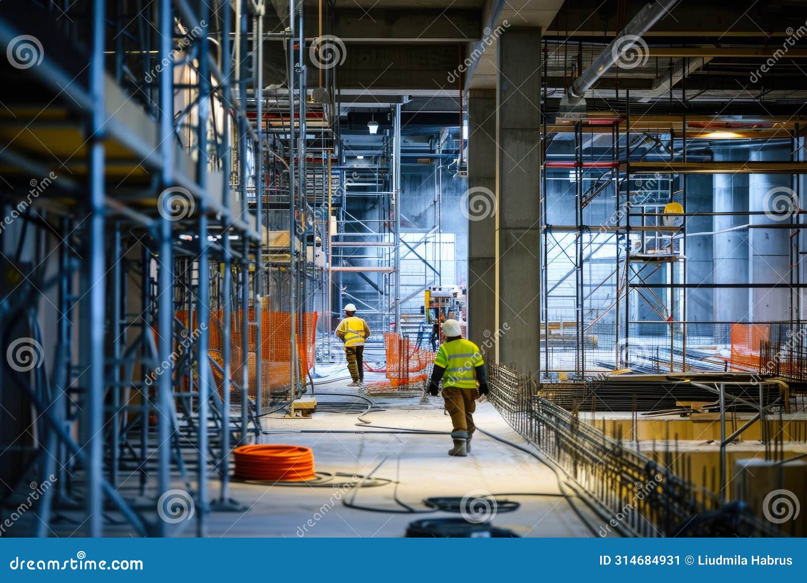 Construction Site with a Group of Workers Installing Electrical Wiring ...