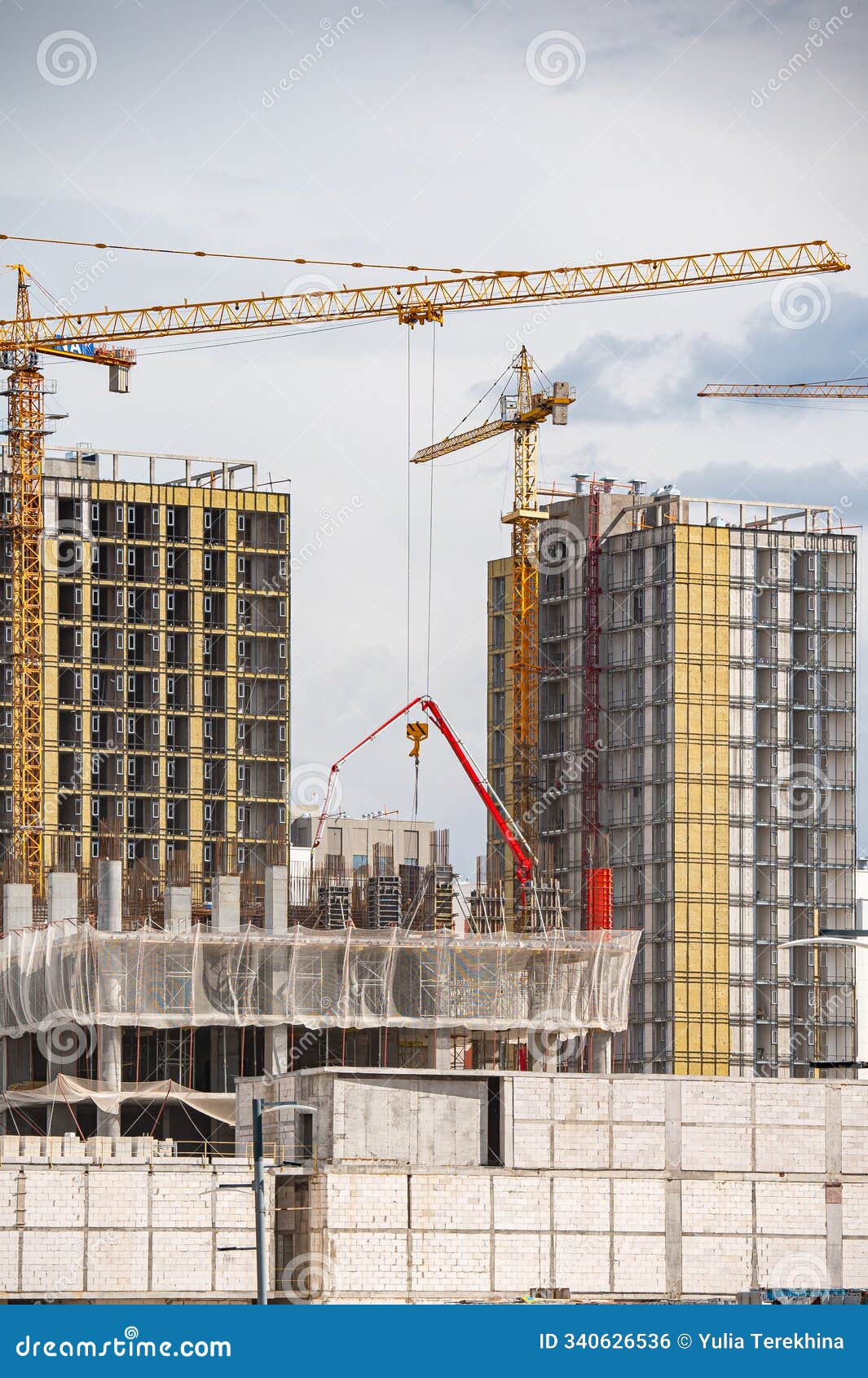 Construction Site with High-rise Buildings in Progress, Yellow Tower ...