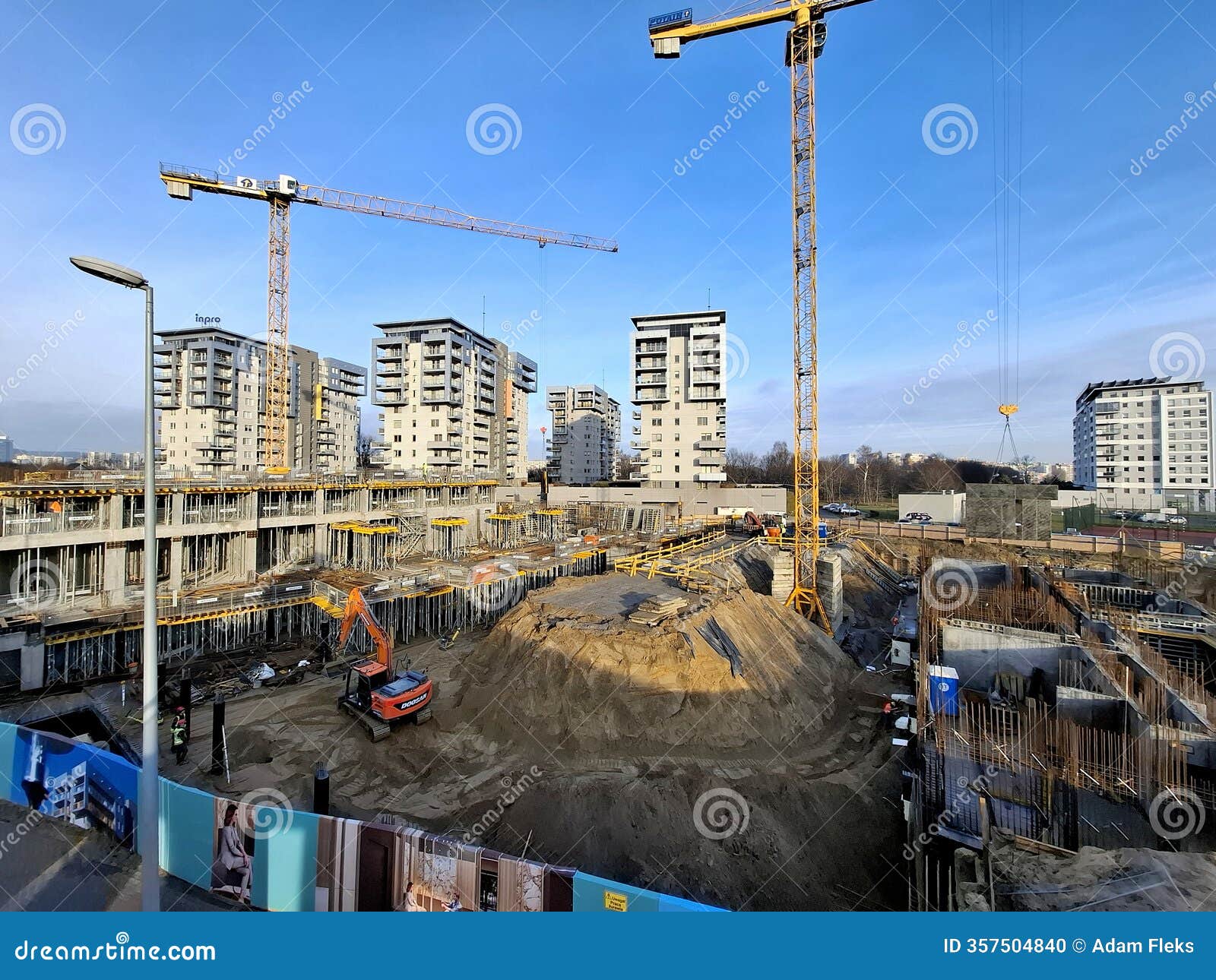 Construction Site of a House with Building Cranes and Excavation ...