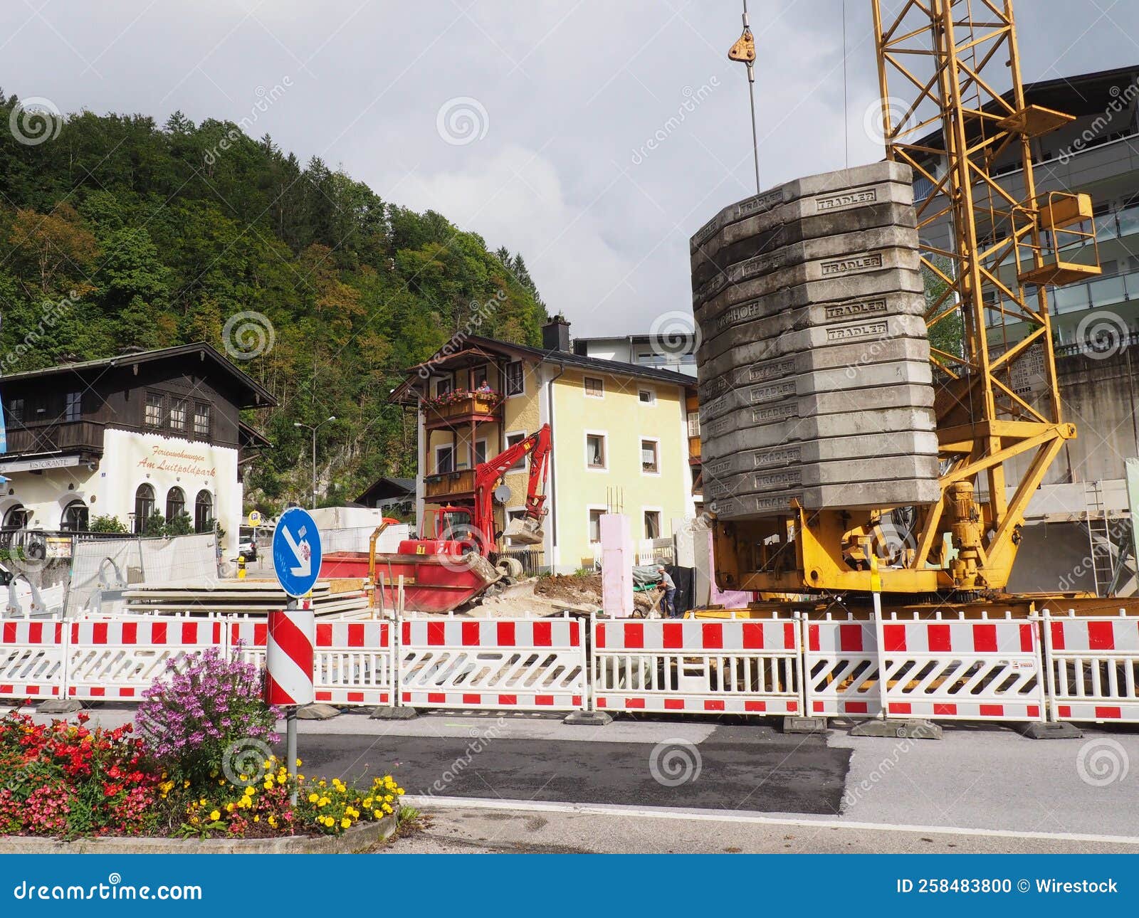 Construction Site with Houses a Crane Concrete Weights and Barriers ...