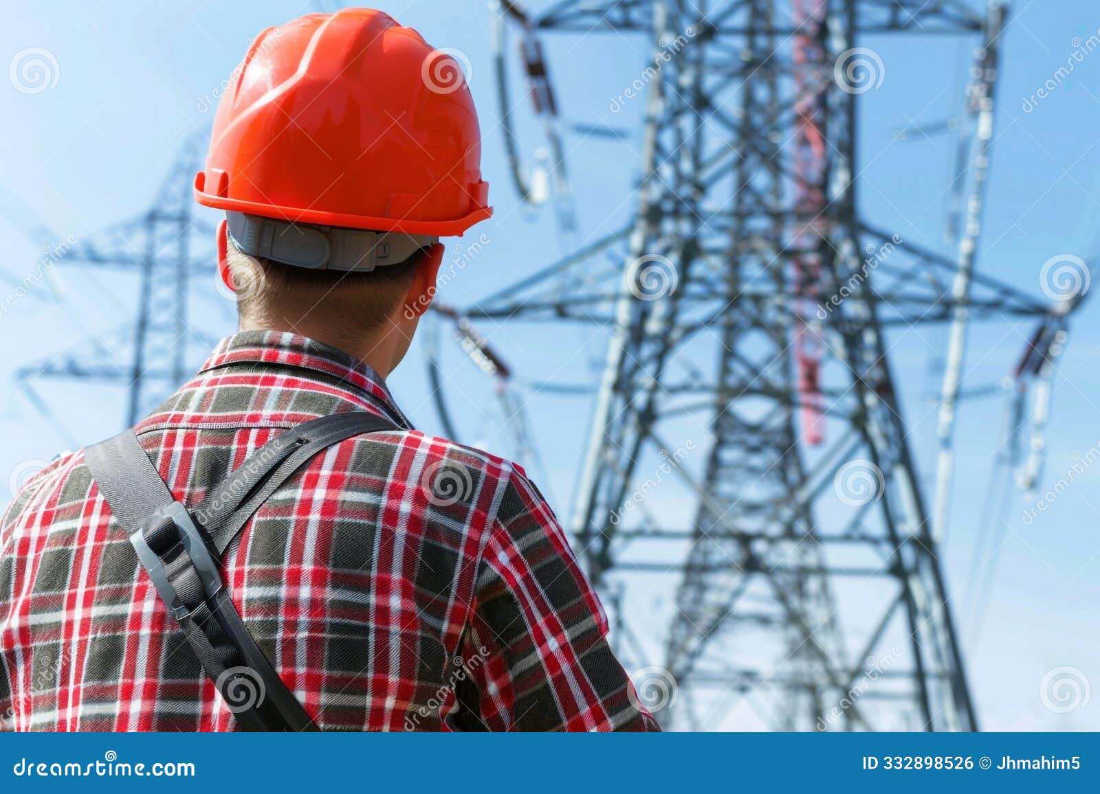 Construction Site Inspector in Hardhat Ensuring Safety at an Electric ...
