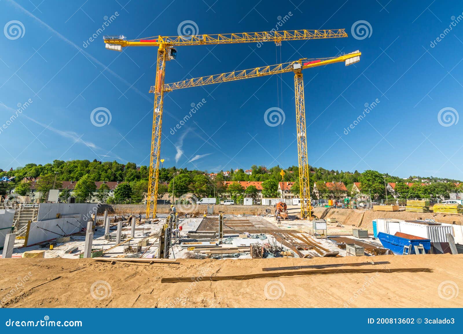 Construction Site with Large Excavation and Cranes on a Sunny Day Stock ...