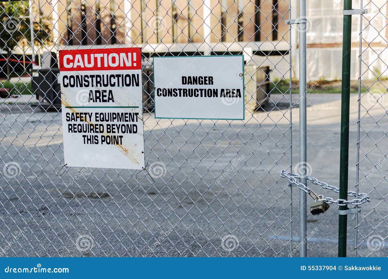 Construction Site with Locked Gate and Caution Sign Stock Photo - Image ...