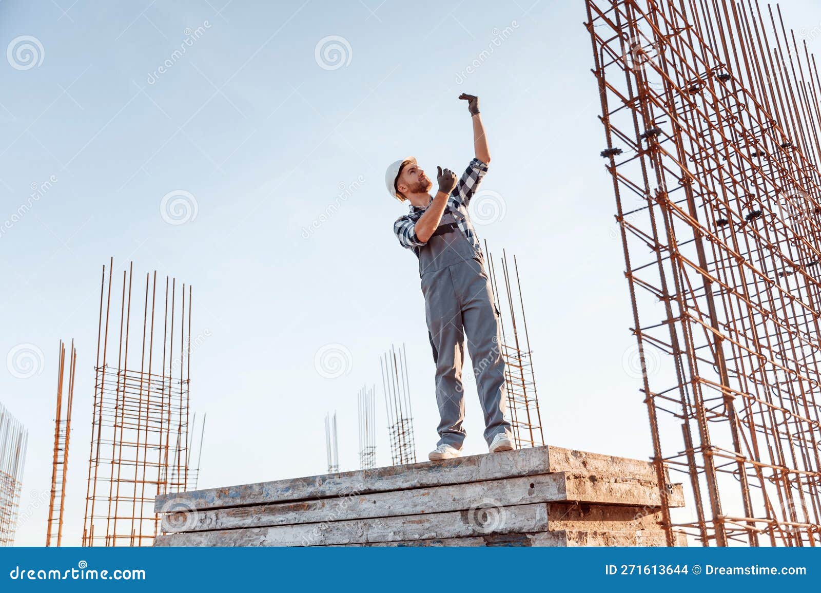 On Construction Site. Man in Grey Uniform is Working Stock Photo ...