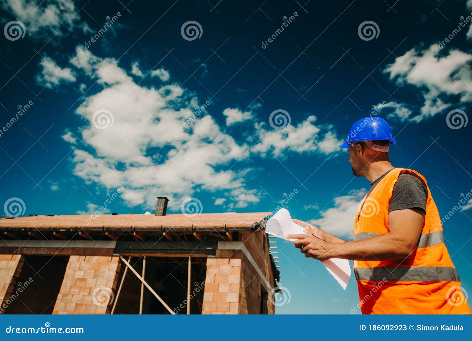 Construction, Site Manager Overseeing Construction of the New Building ...