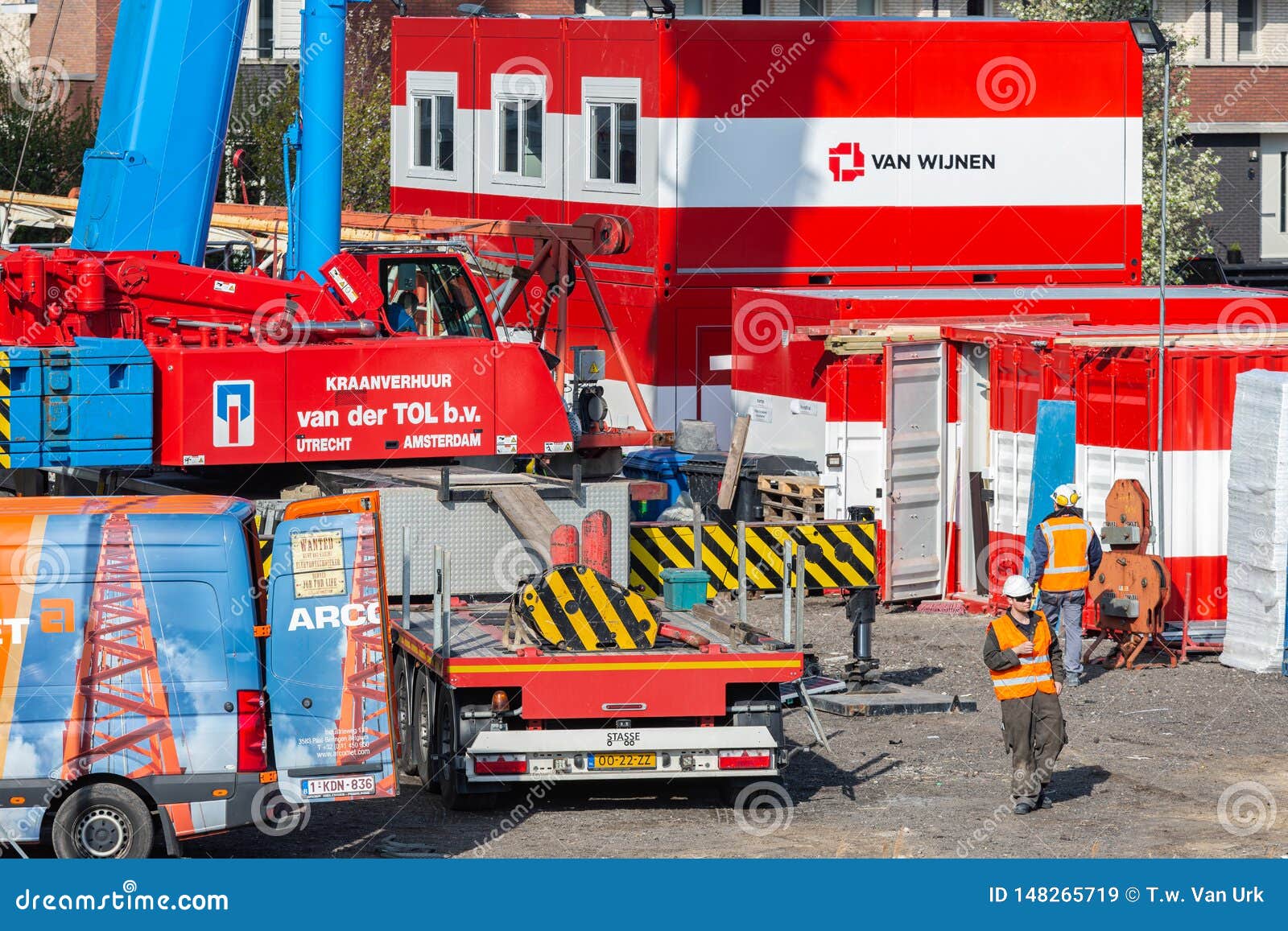 Construction Site with Mobile Crane, Storage Containers and Crew Wagons ...