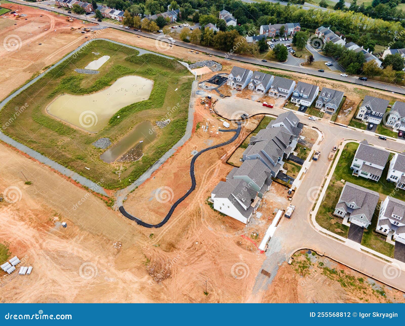 Construction Site with New Houses and Prepared Place for Construction ...