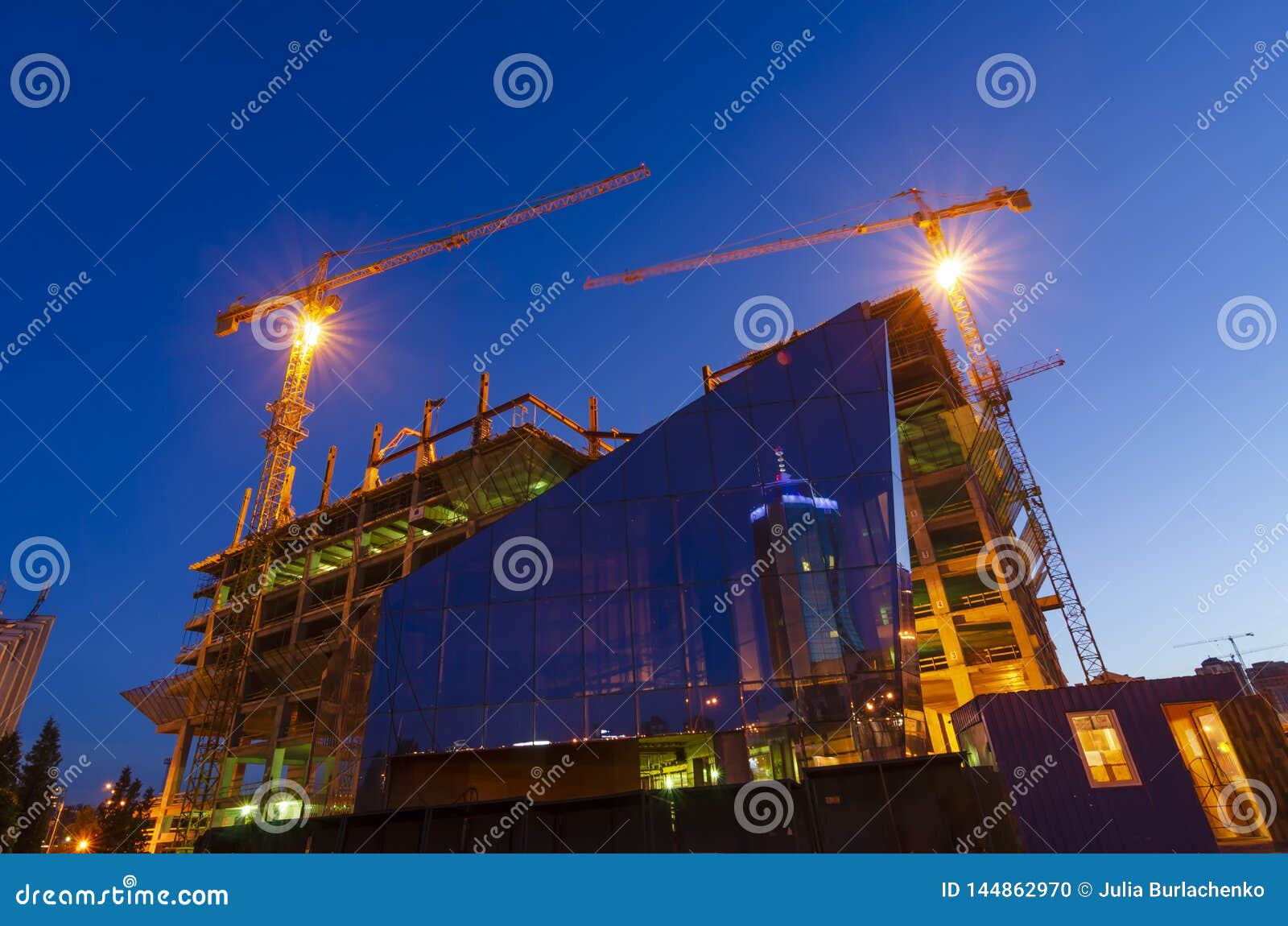Construction site at night stock photo. Image of building - 144862970