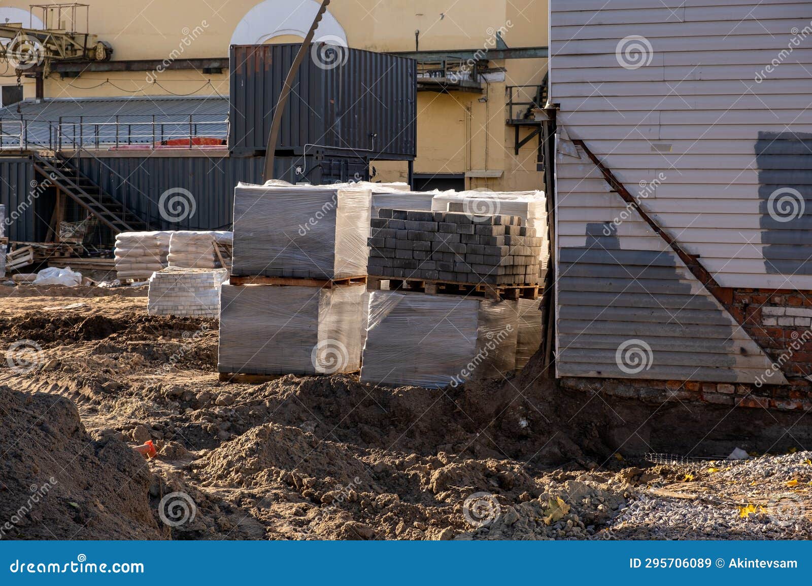 Construction Site with Paving Stones in Pallets and Other Building ...