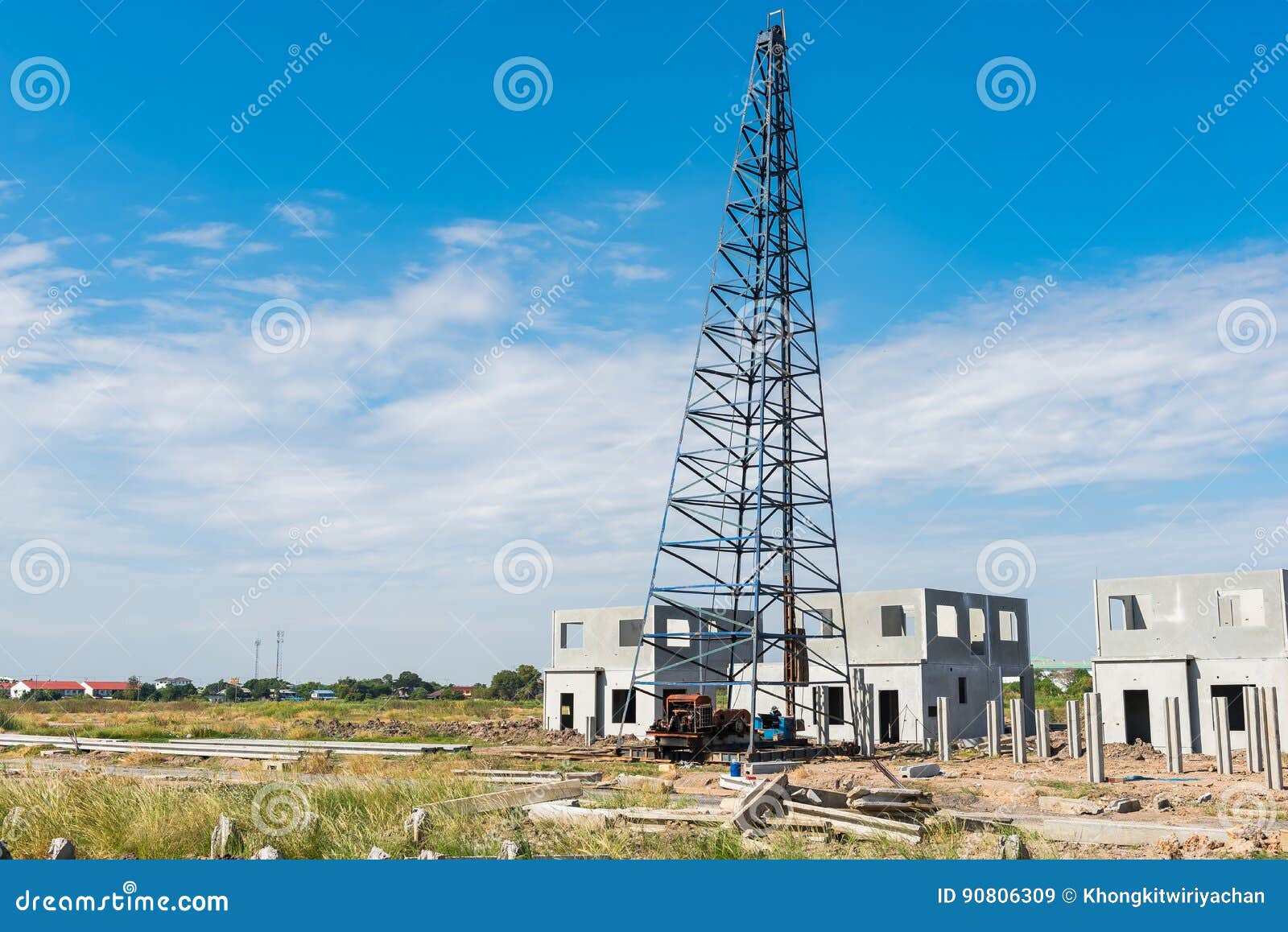 Construction Site with Pile-driver Working and Precast Housing Stock ...