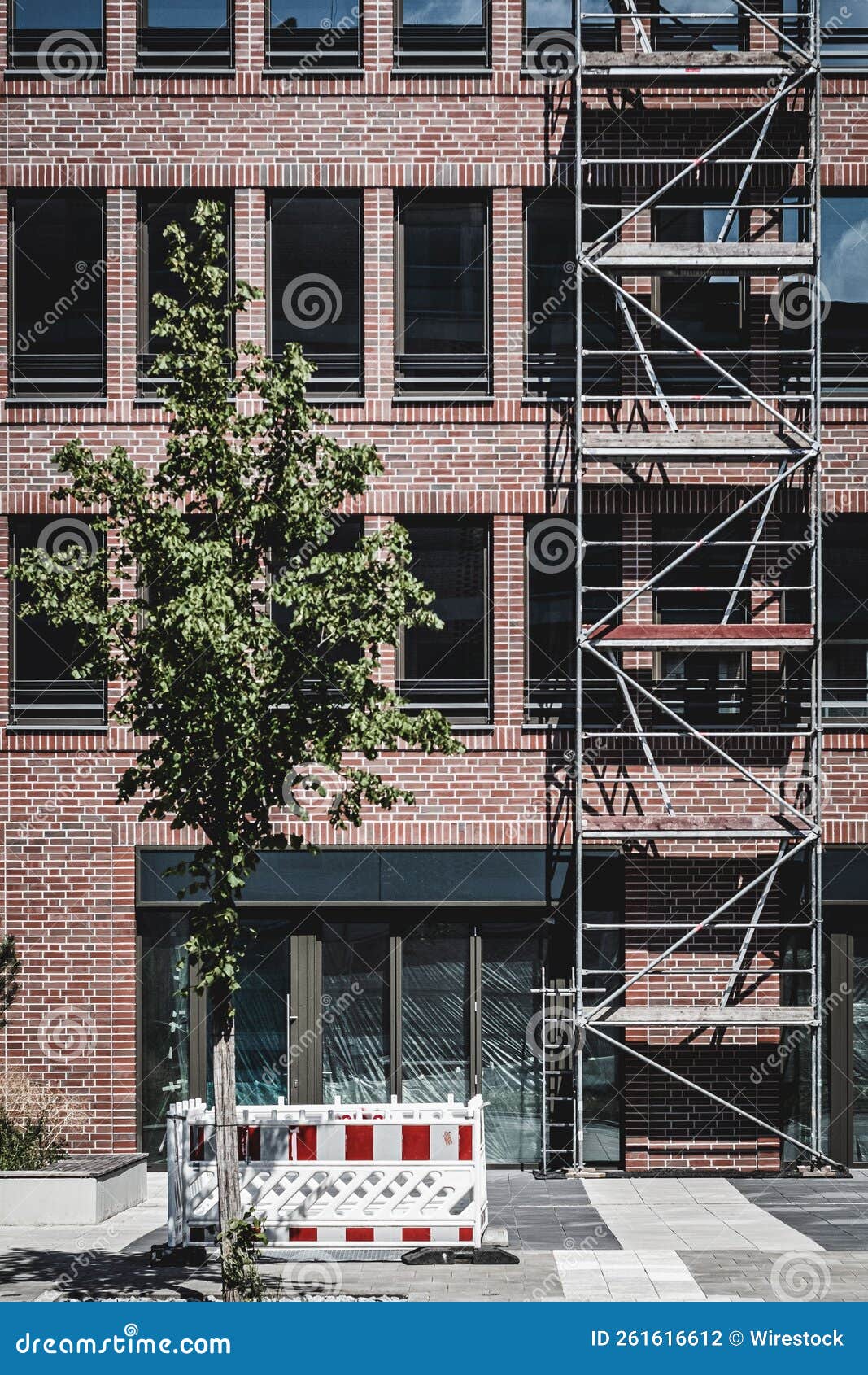 Construction Site with a Scaffold in Front of a Red Brick Wall Building ...