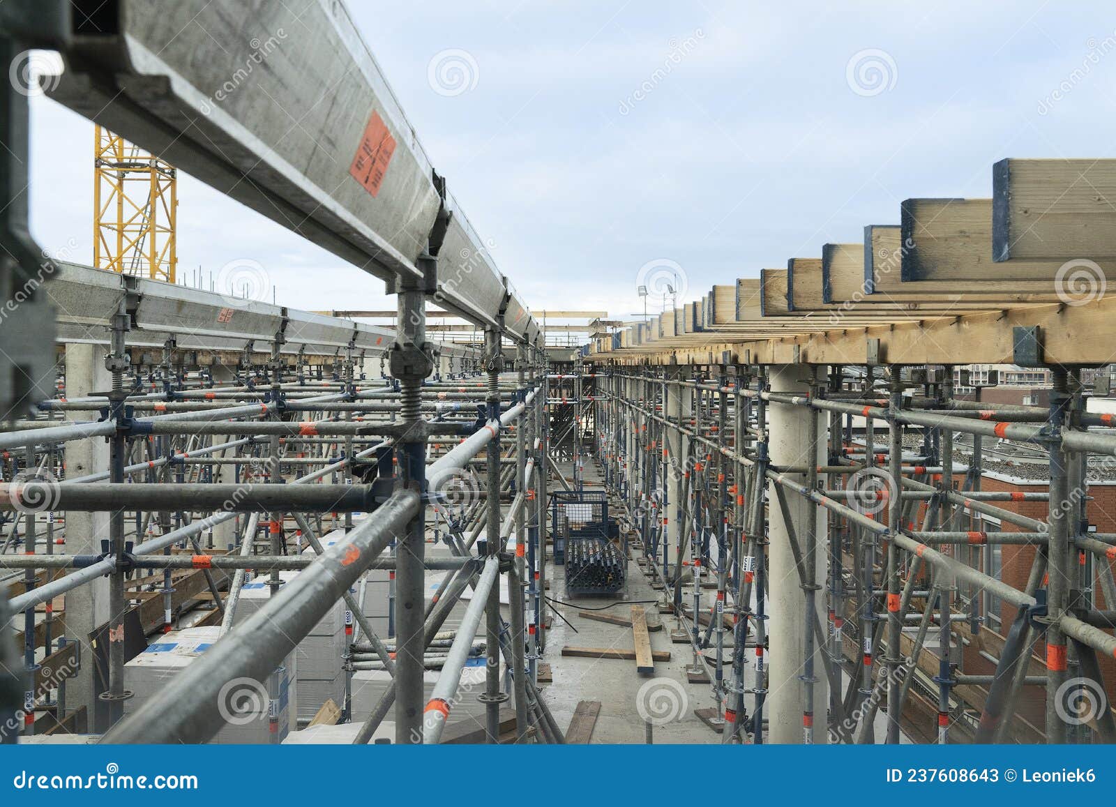 Construction Site With Scaffolding, Concrete Pillars, Tower Crane For ...