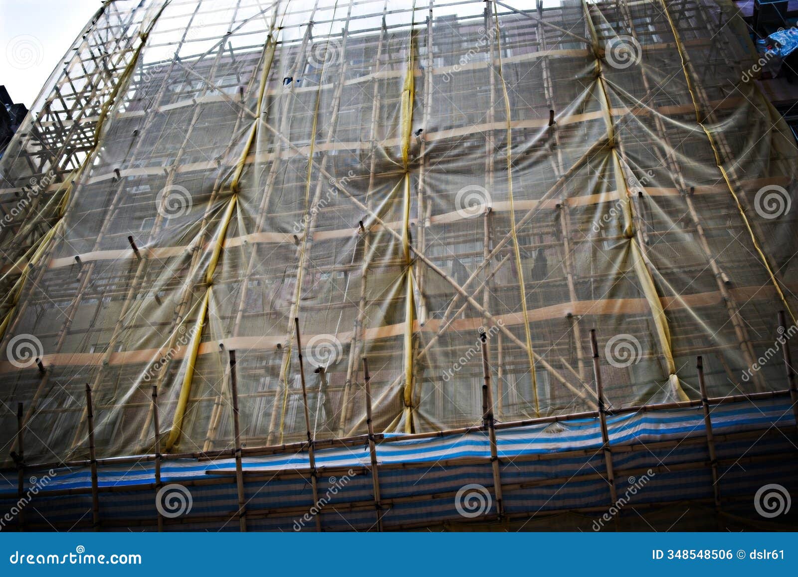 Construction Site with Scaffolding and Protective Mesh Stock Photo ...